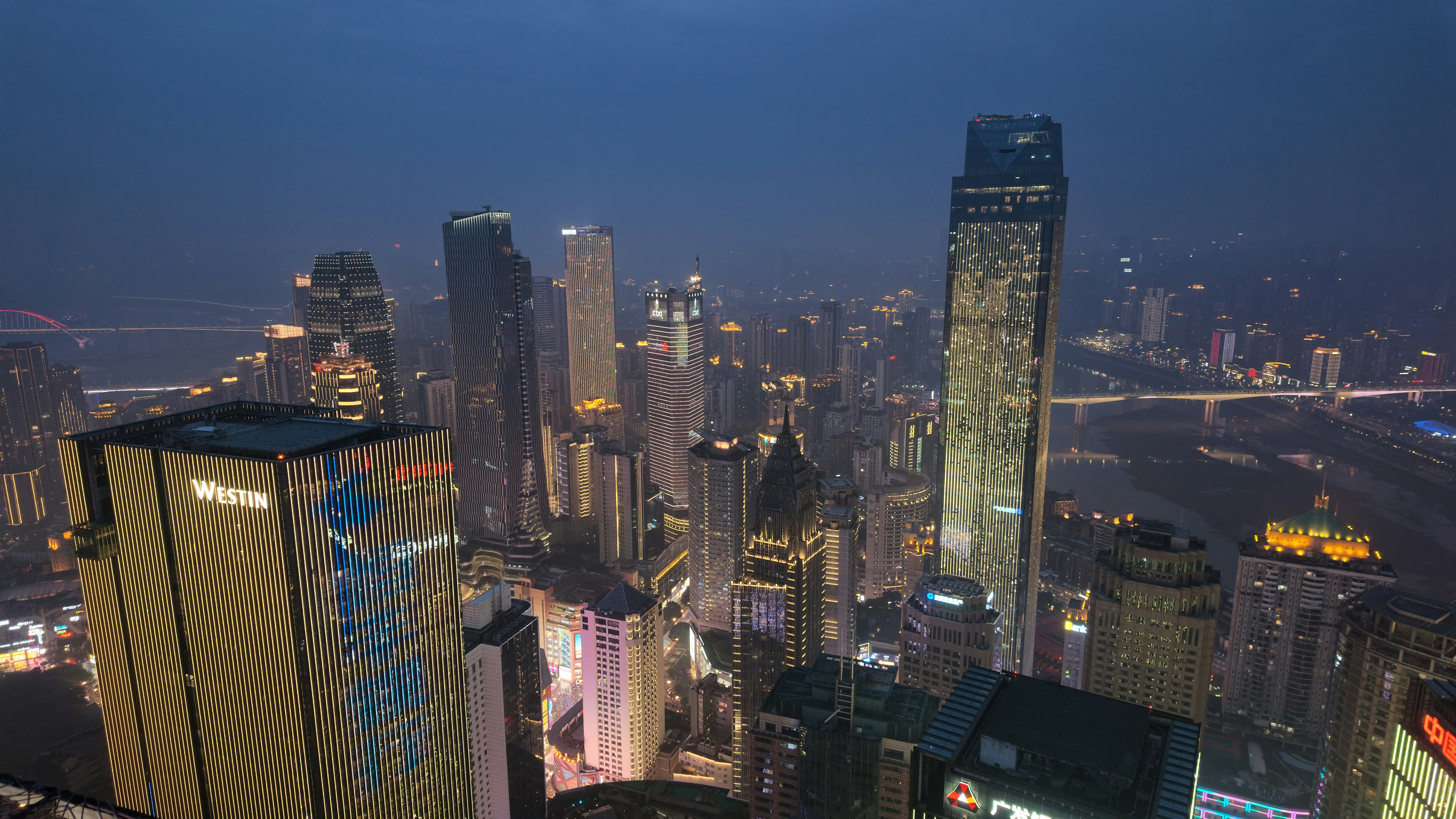 Midnight Metropolis: Neon Towers Crown the Riverbend