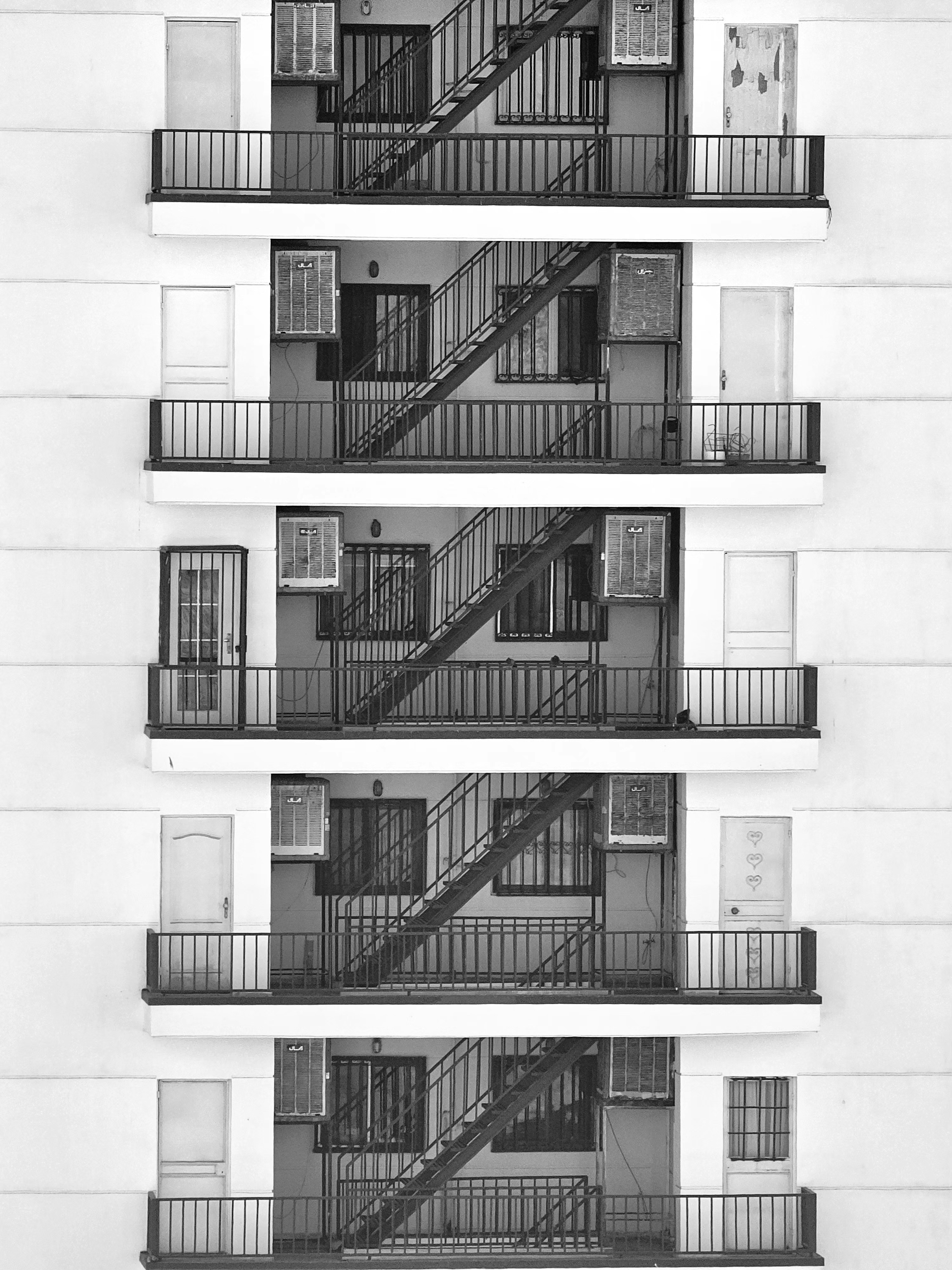 Aligned Fire Escapes: A Monochrome Vertical Grid