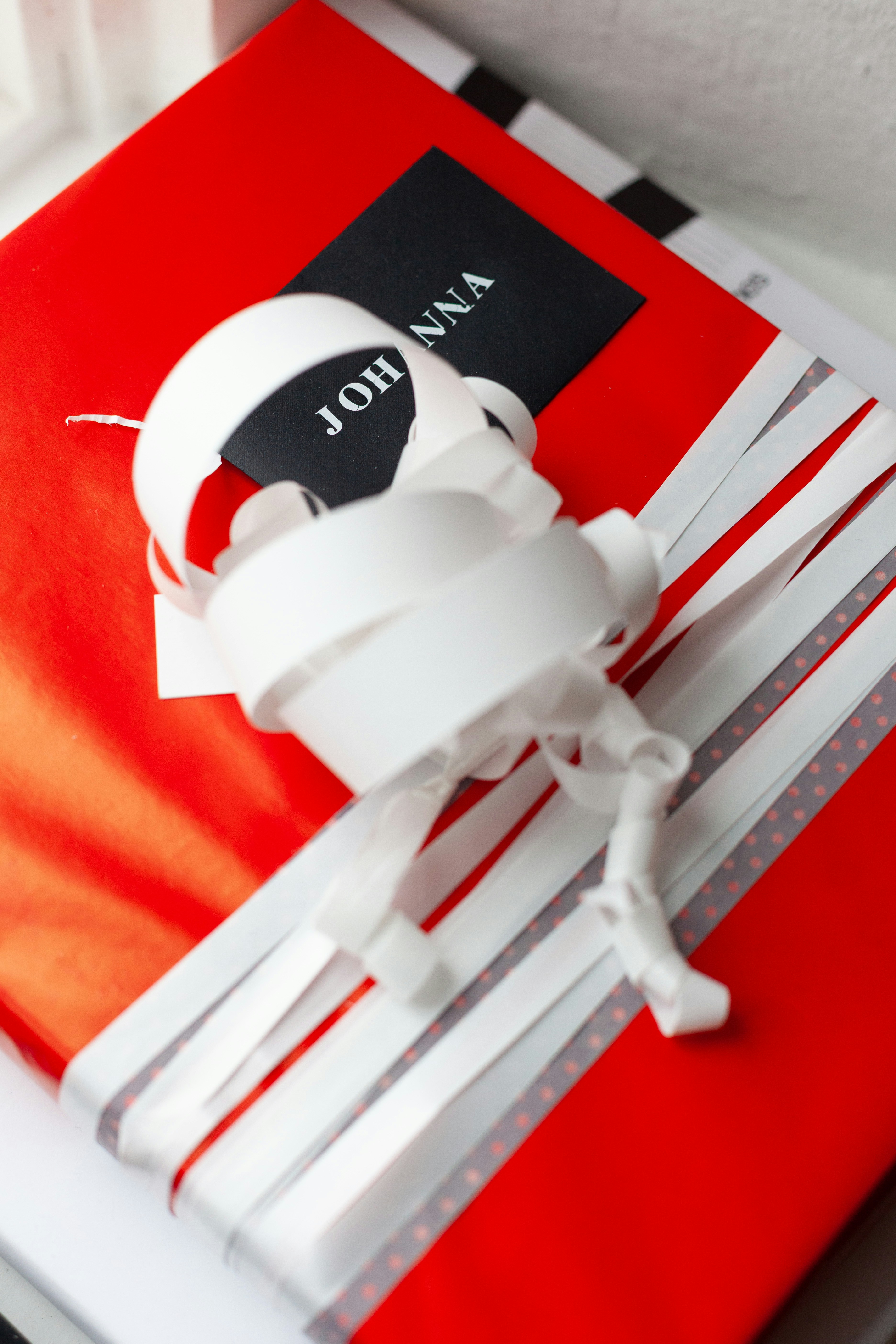 Gift Box Secrets: White Ribbon on a Bold Red Canvas