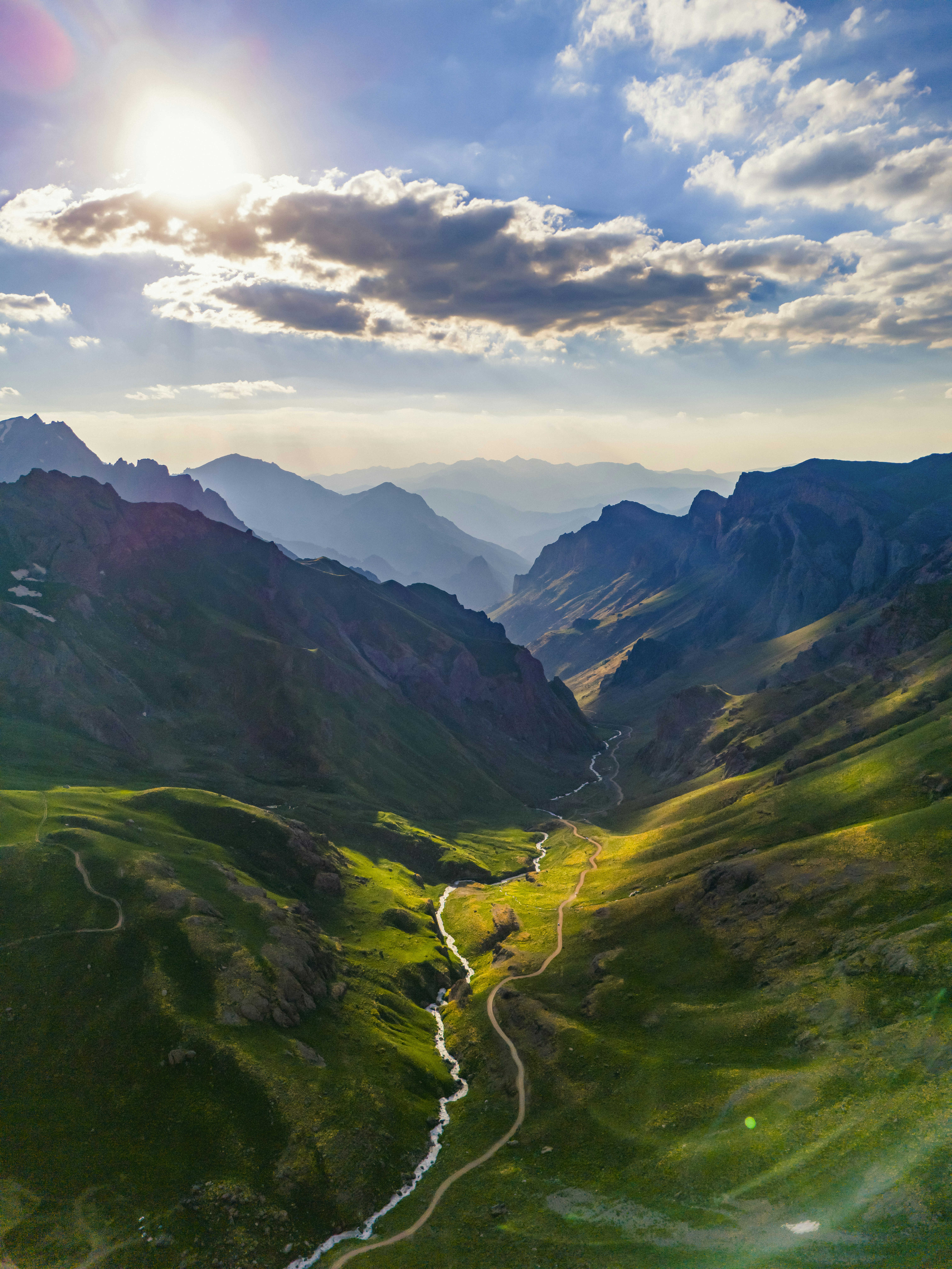 Sunlit Valley River: A Winding Silk of Light Through Alpine Valleys
