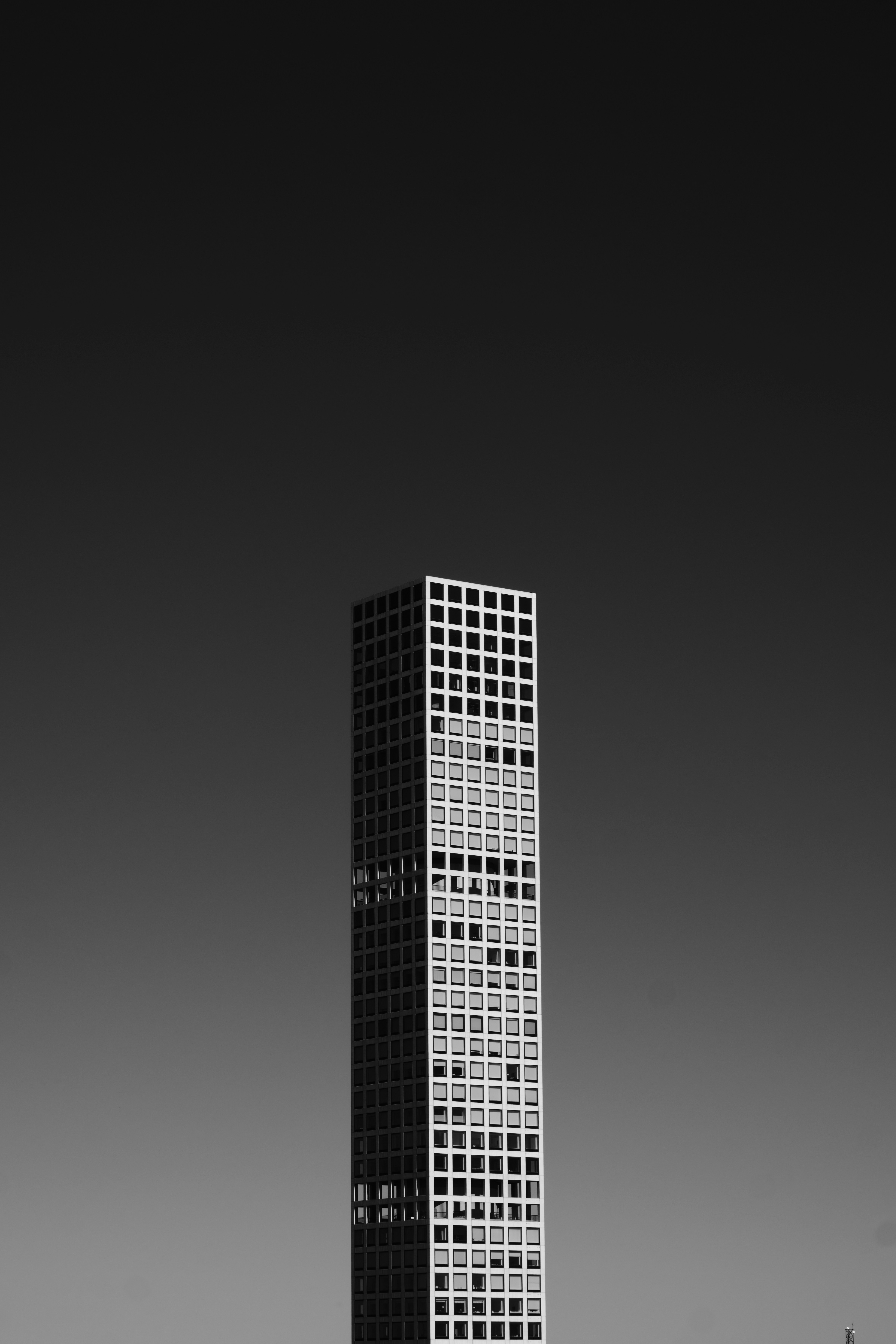 Monolithic Skyline: A Lone Tower Reaches Toward the Dusk
