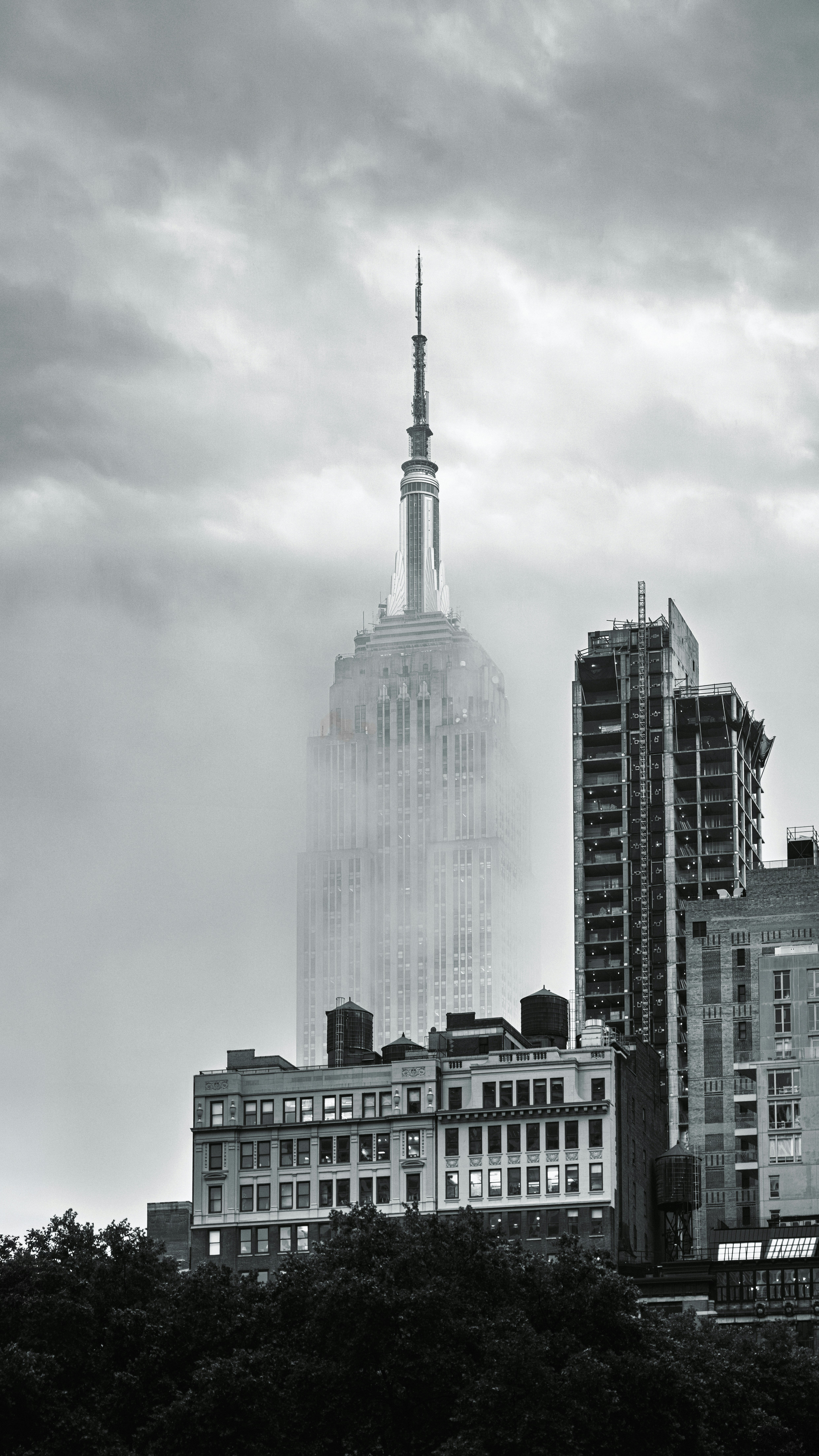 Skyward Amid the Fog: Empire State Emerging from Cloud Veil