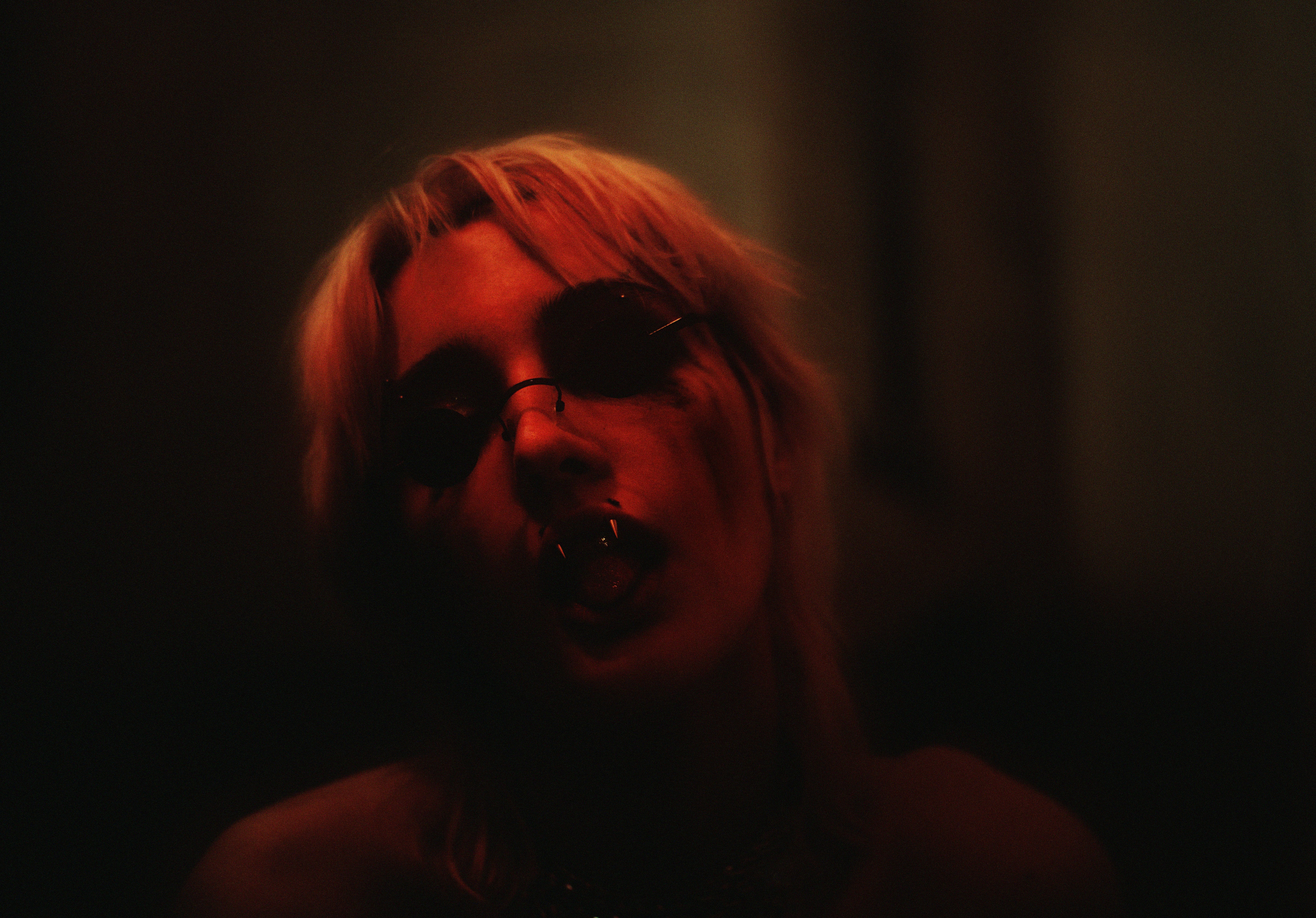 Shadowed Gaze in the Neon Veil