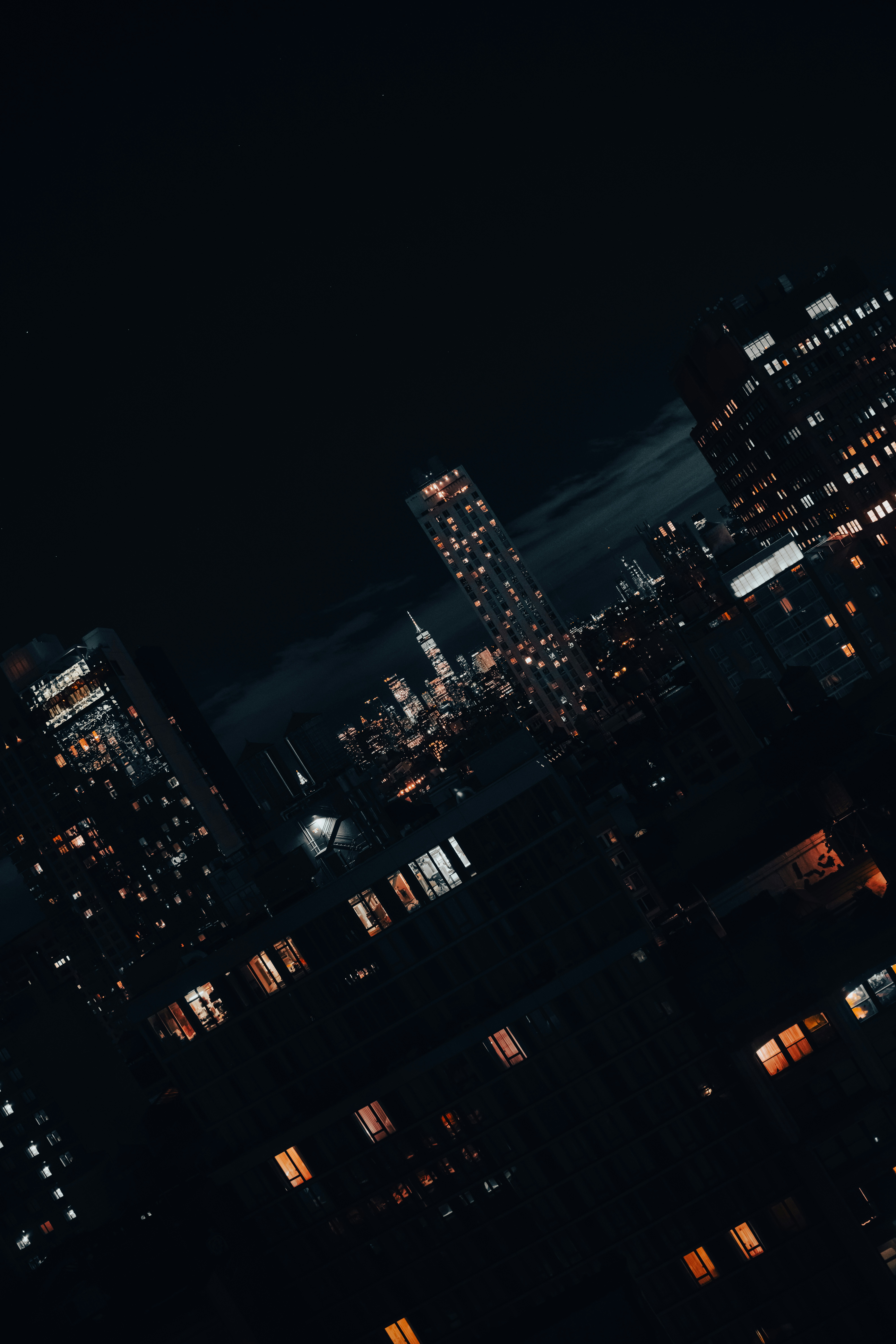 Midnight Skyline: Neon Windows and Quiet Elevation