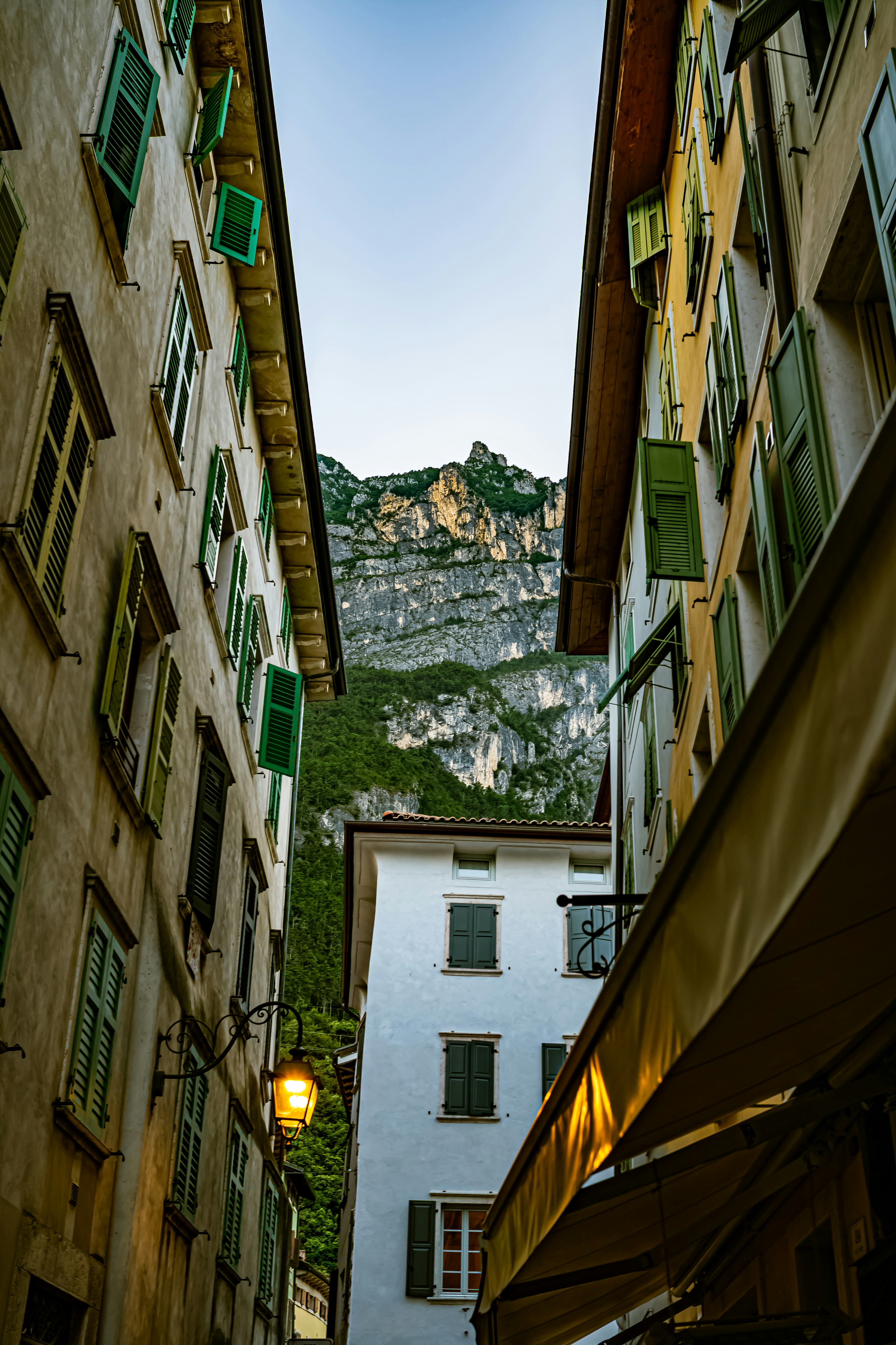 Between Alpine Walls: A Narrow Street Framing a Mountain Crest
