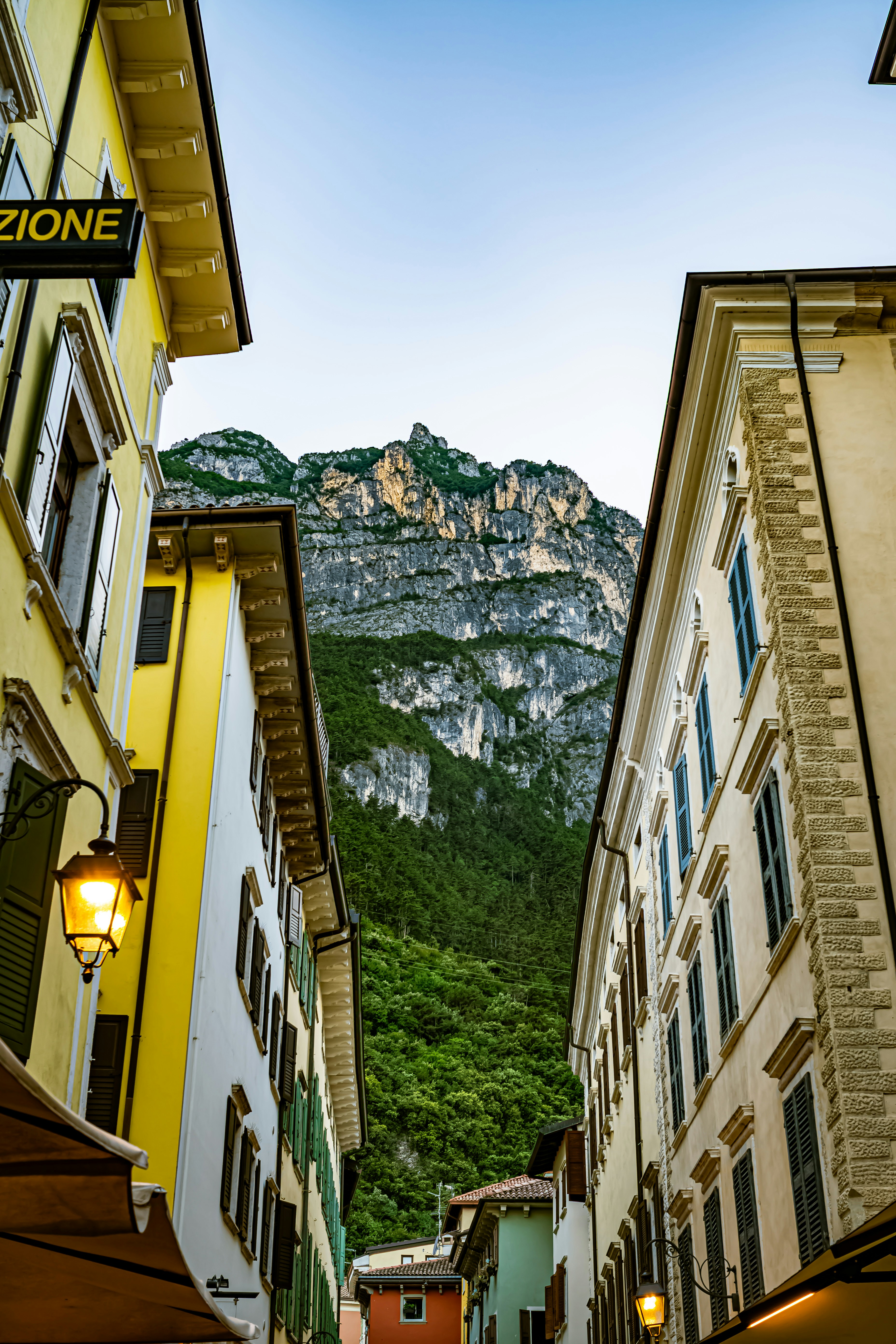 Nestled street to a towering mountain blade