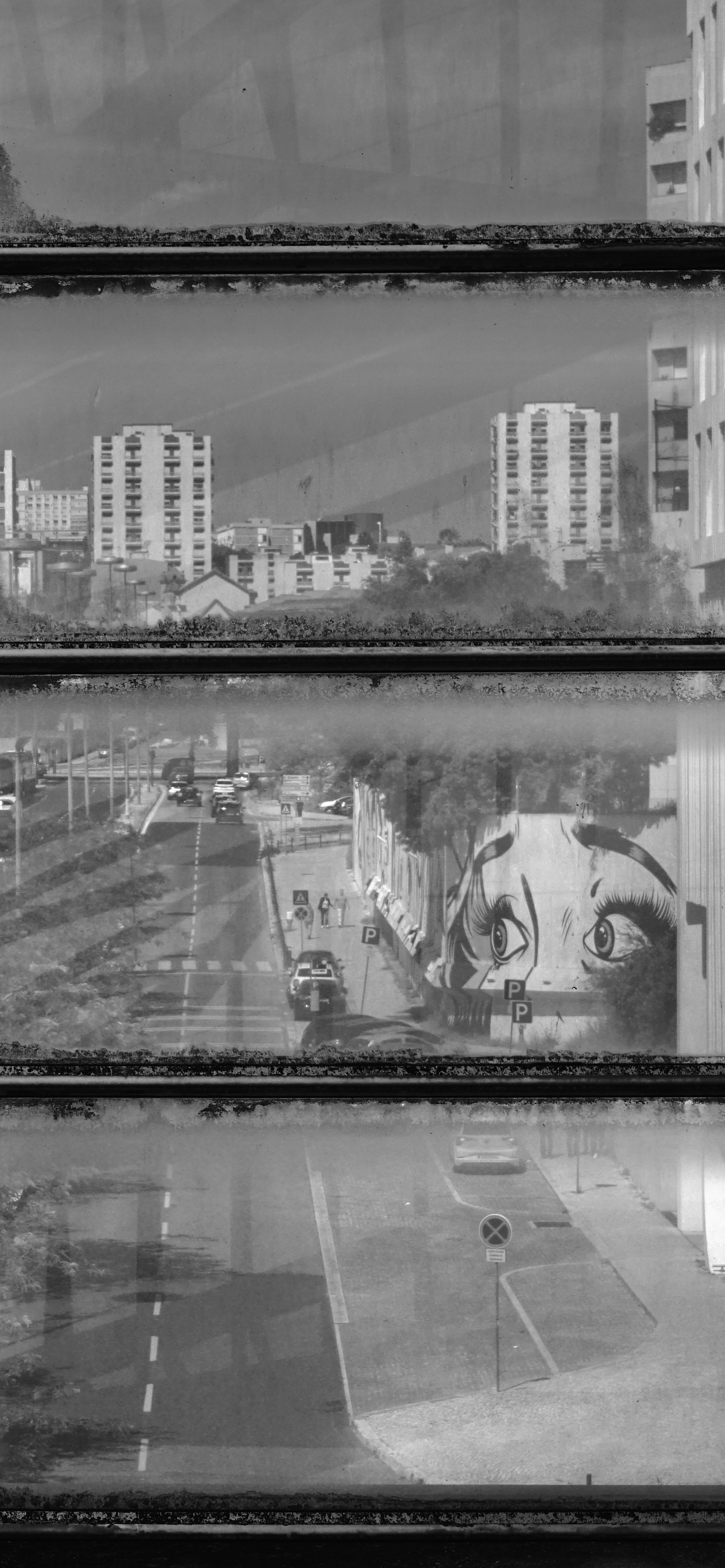 Industrial Mirror: Cityscape Reflections Across Train Rails