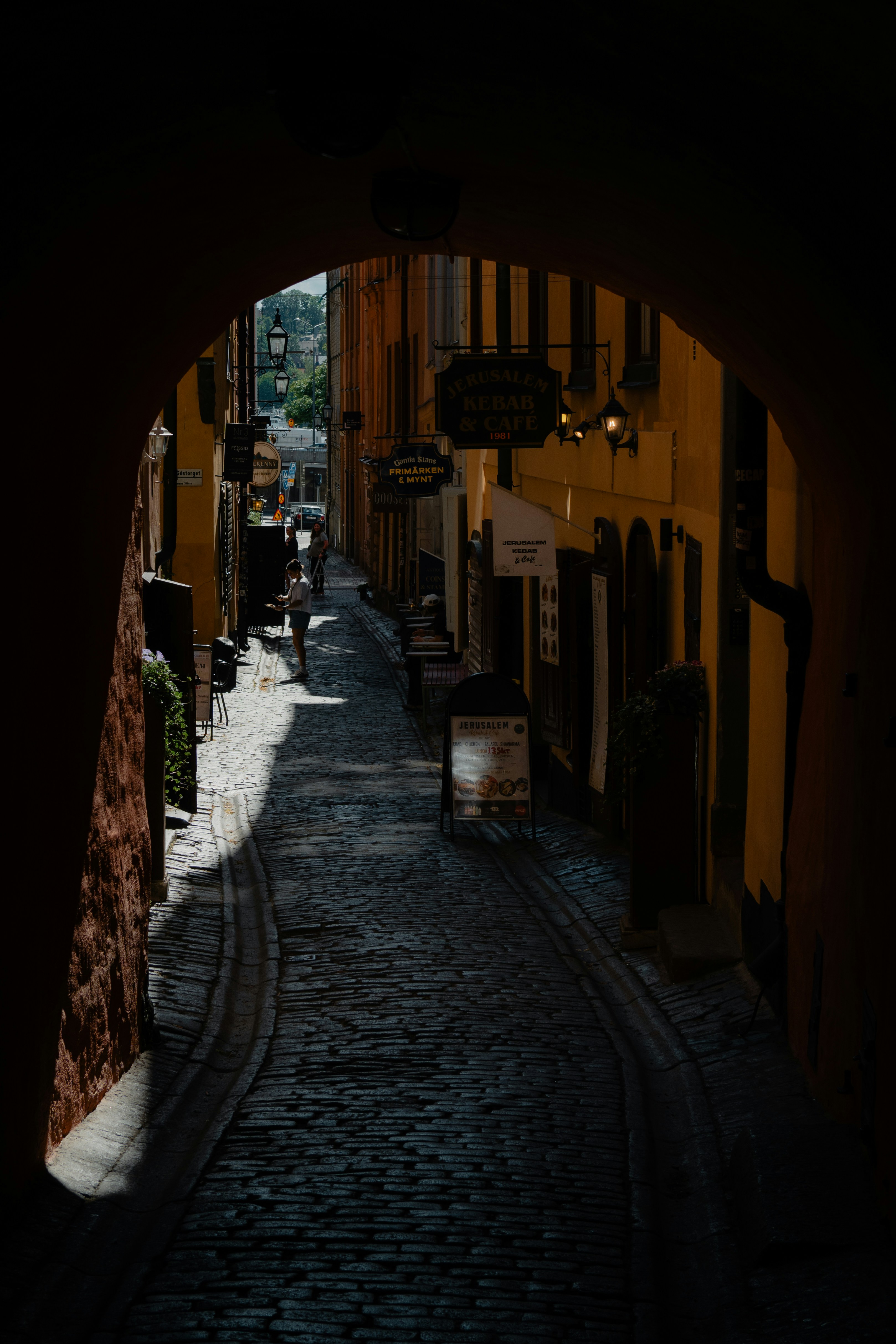 Through the Archway to the Quiet Cobbled Street