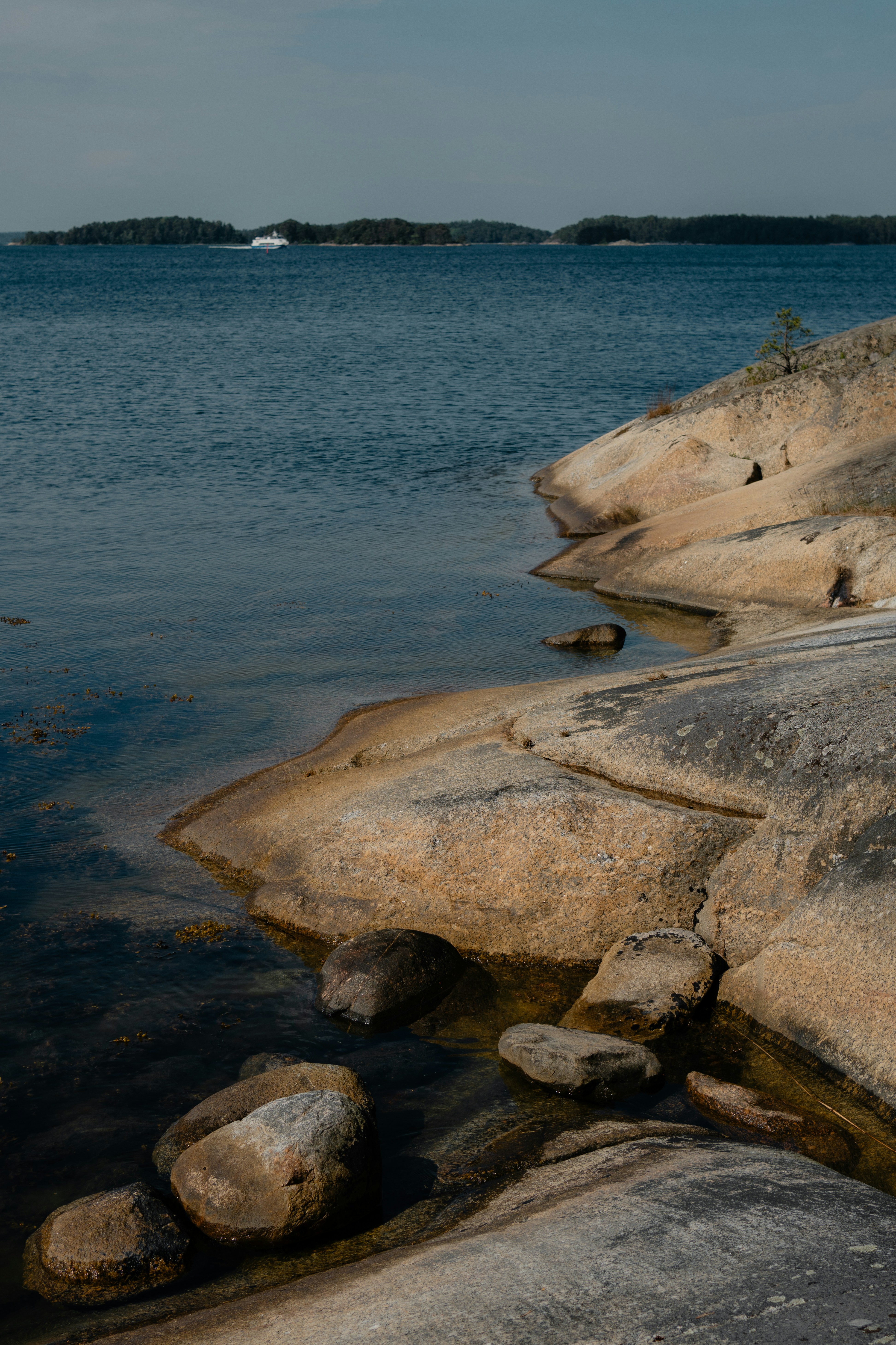 Coastal Granite Edge Under a Calm Blue Sky