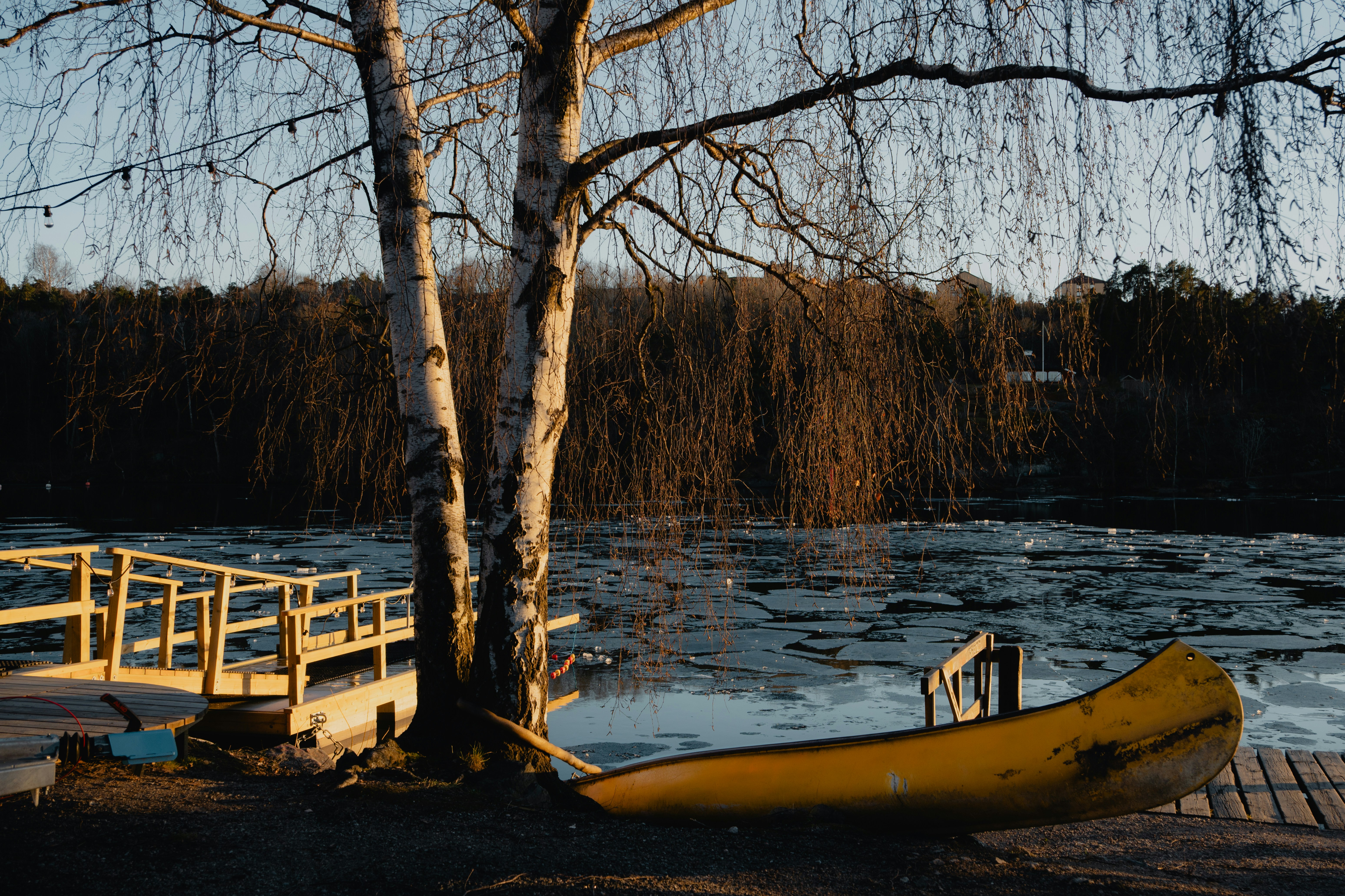Sunlit Canoe by the Quiet Lake