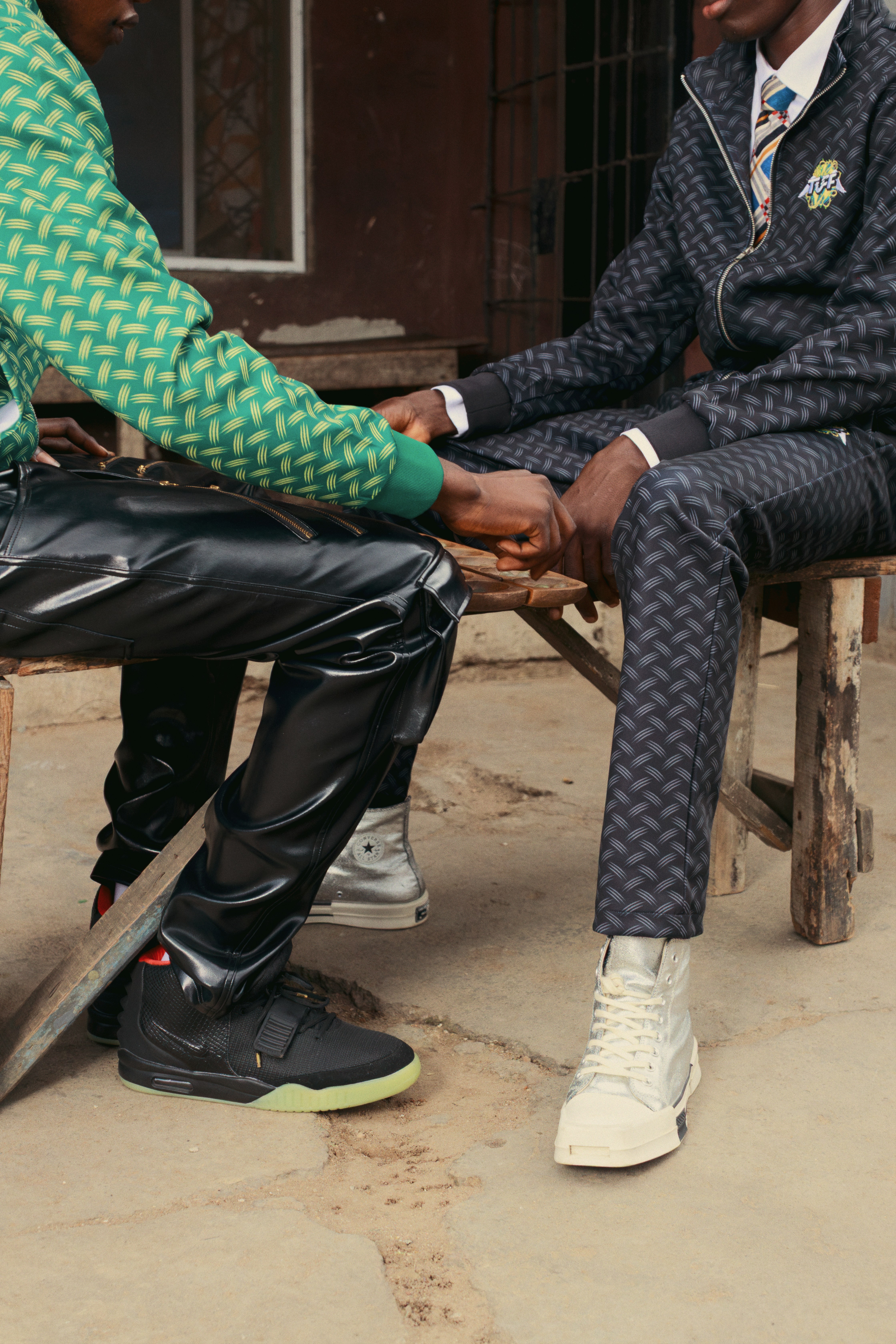 Handshake in the Shade: Two Friends in Stylized Streetwear