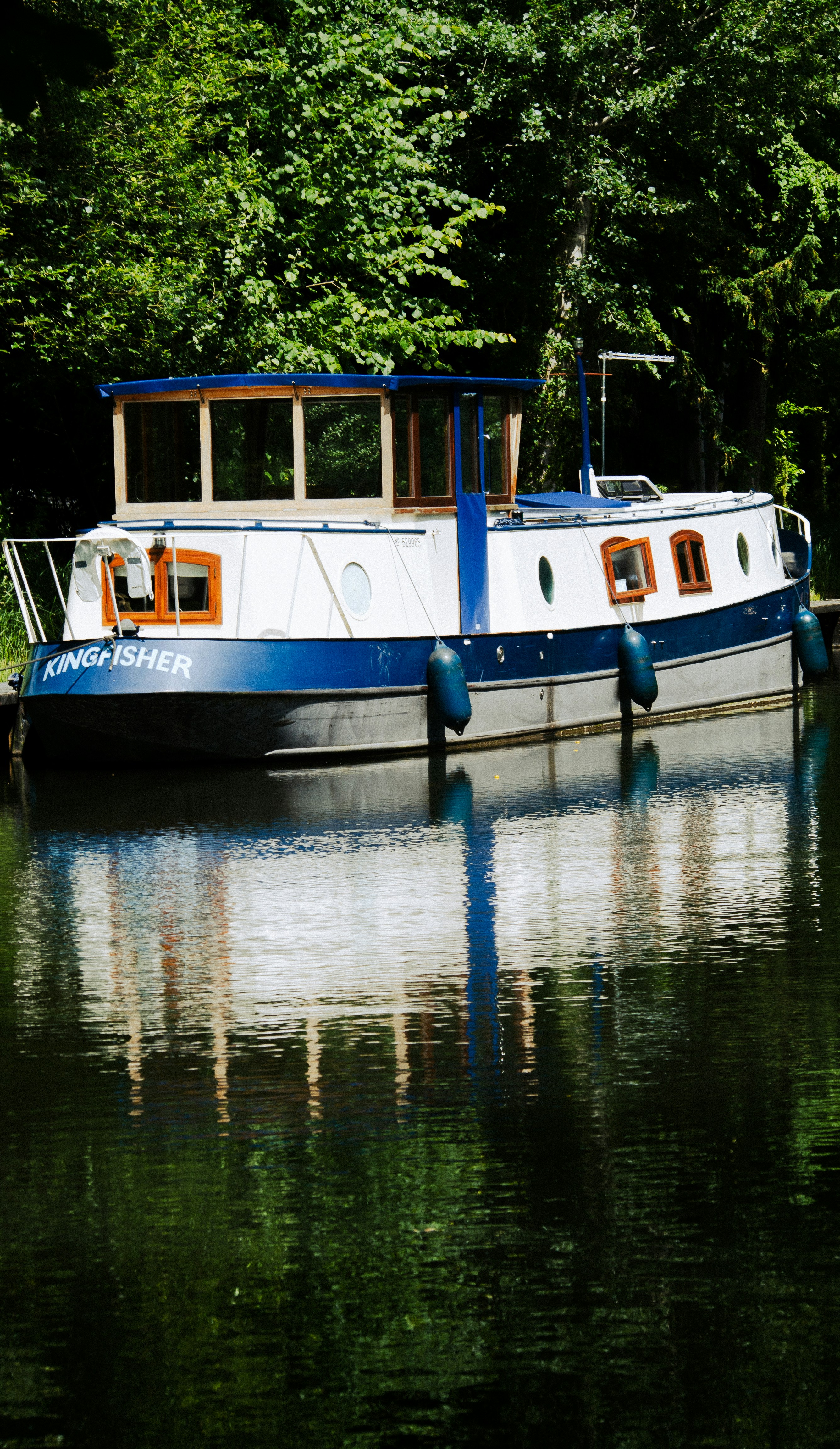 Blue-Walled Riverliner at Dusk—Reflections and Quiet Waters