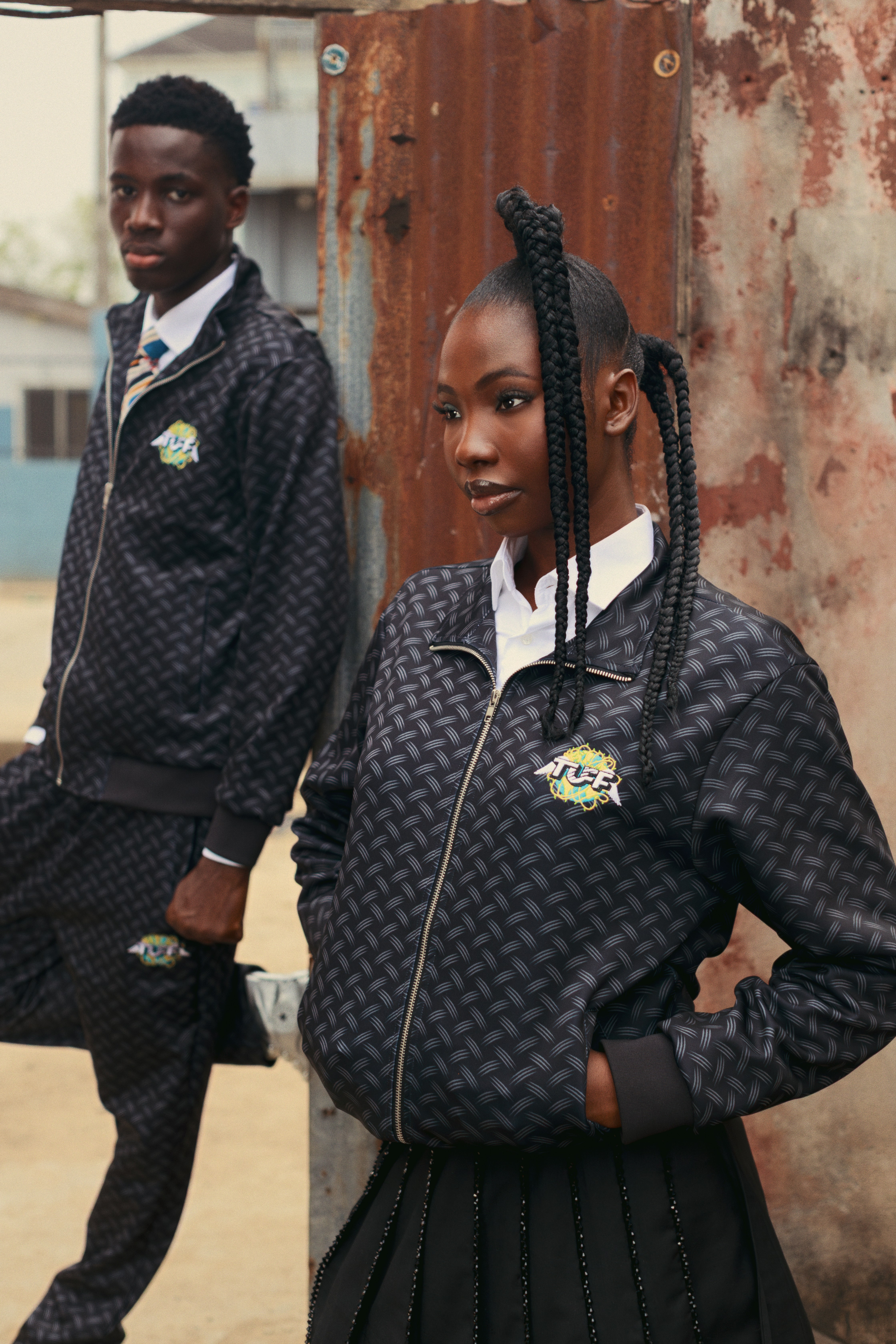 Stance and Steel: Duo in Coordinated Urban Monochrome