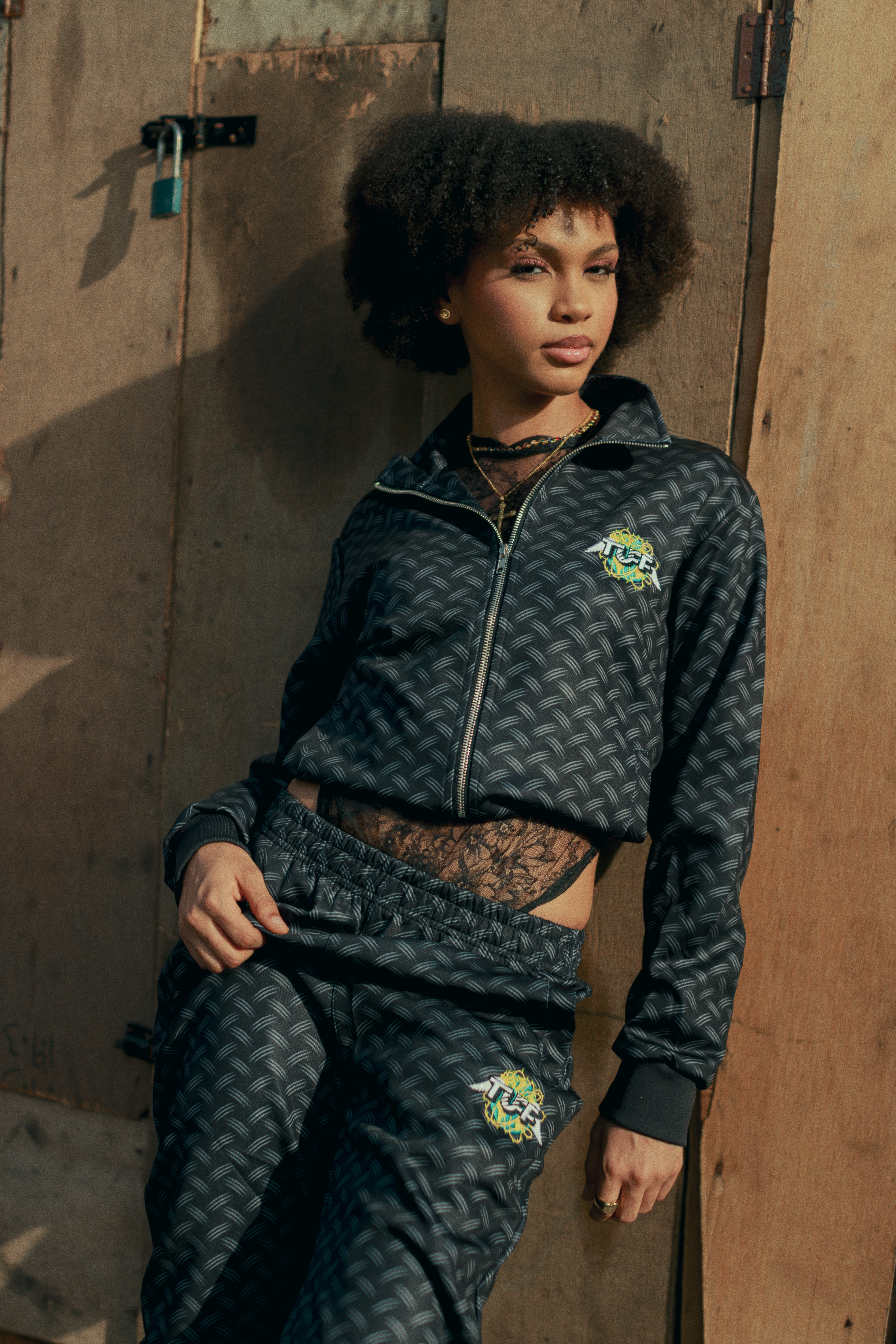 Urban Studio: A Confident Pose in Patterned Tracksuit