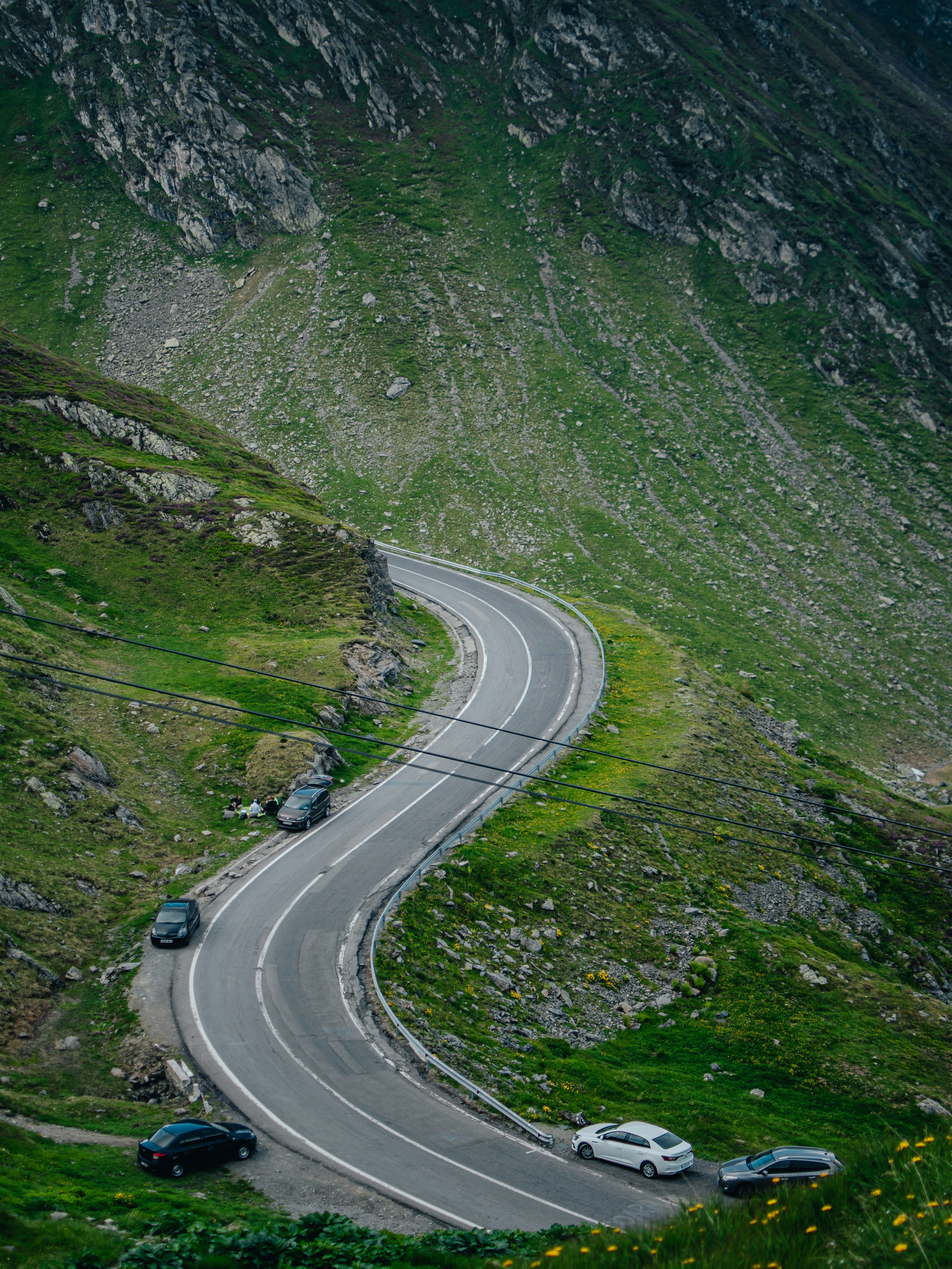 Winding Mountain Passage: A Ribbon of Road Through Green Gullies
