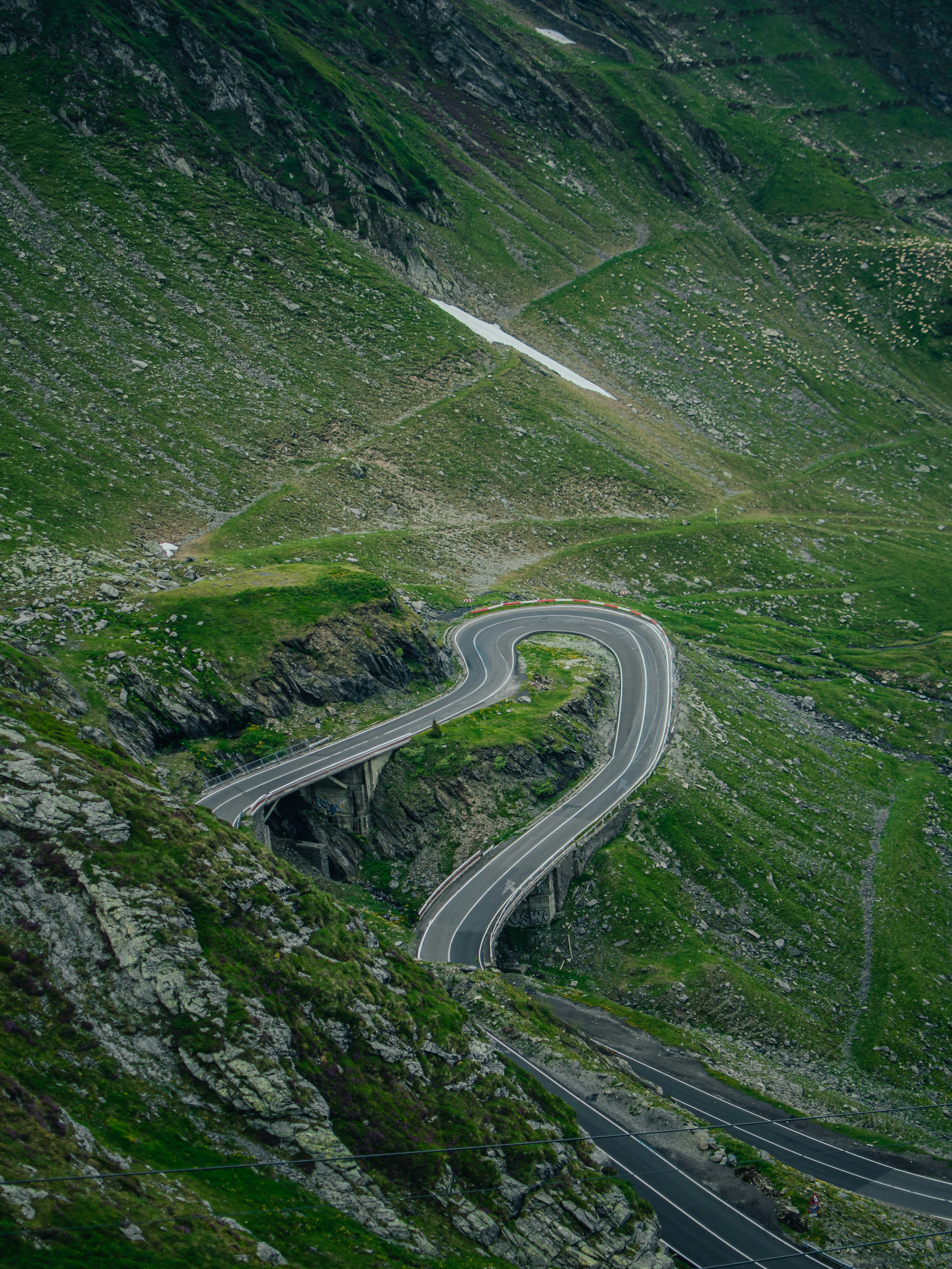 Serpentine Mountain Pass: A Winding Ascent through Green Peaks