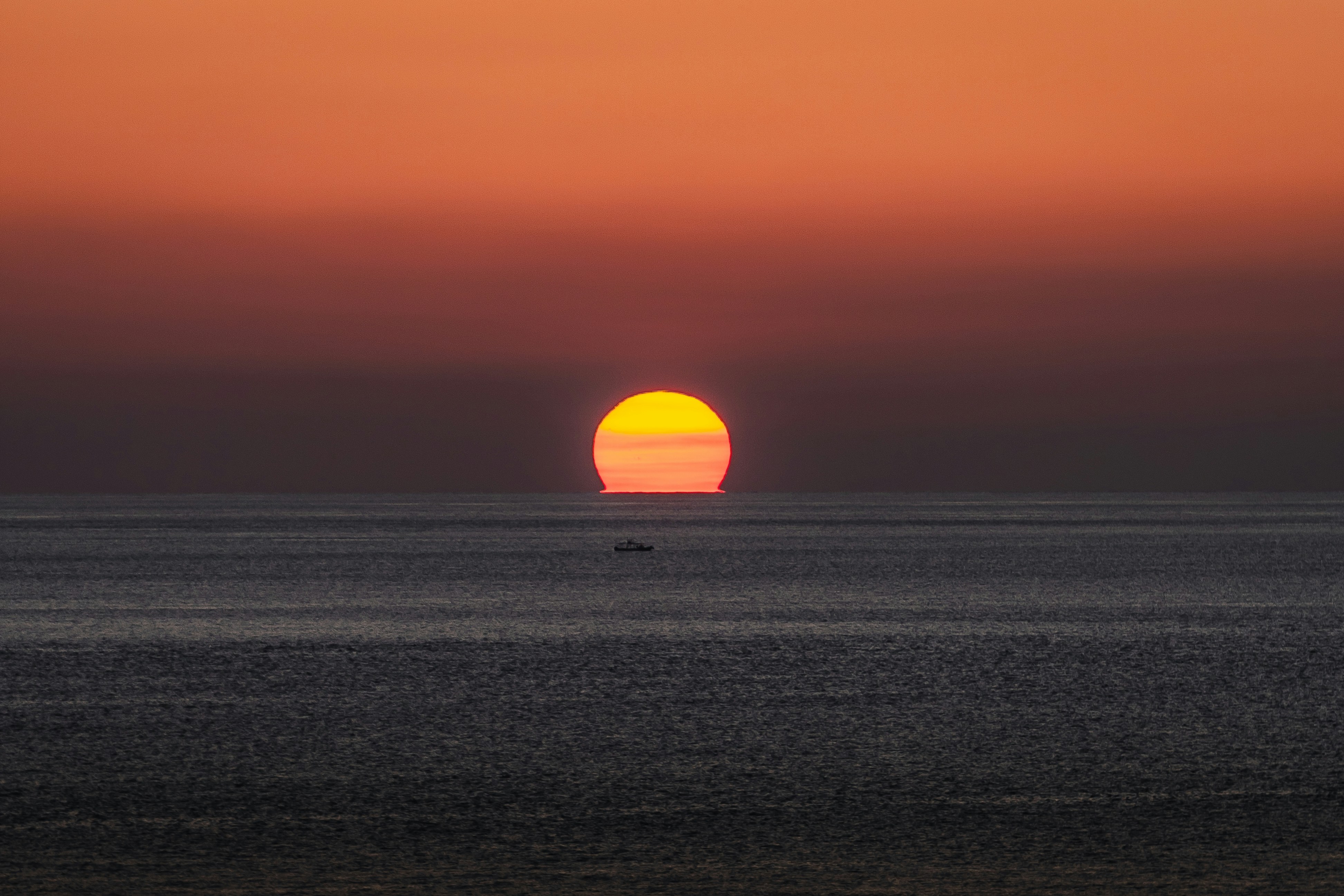 Sun on the Horizon: A Quiet Sea at Dusk