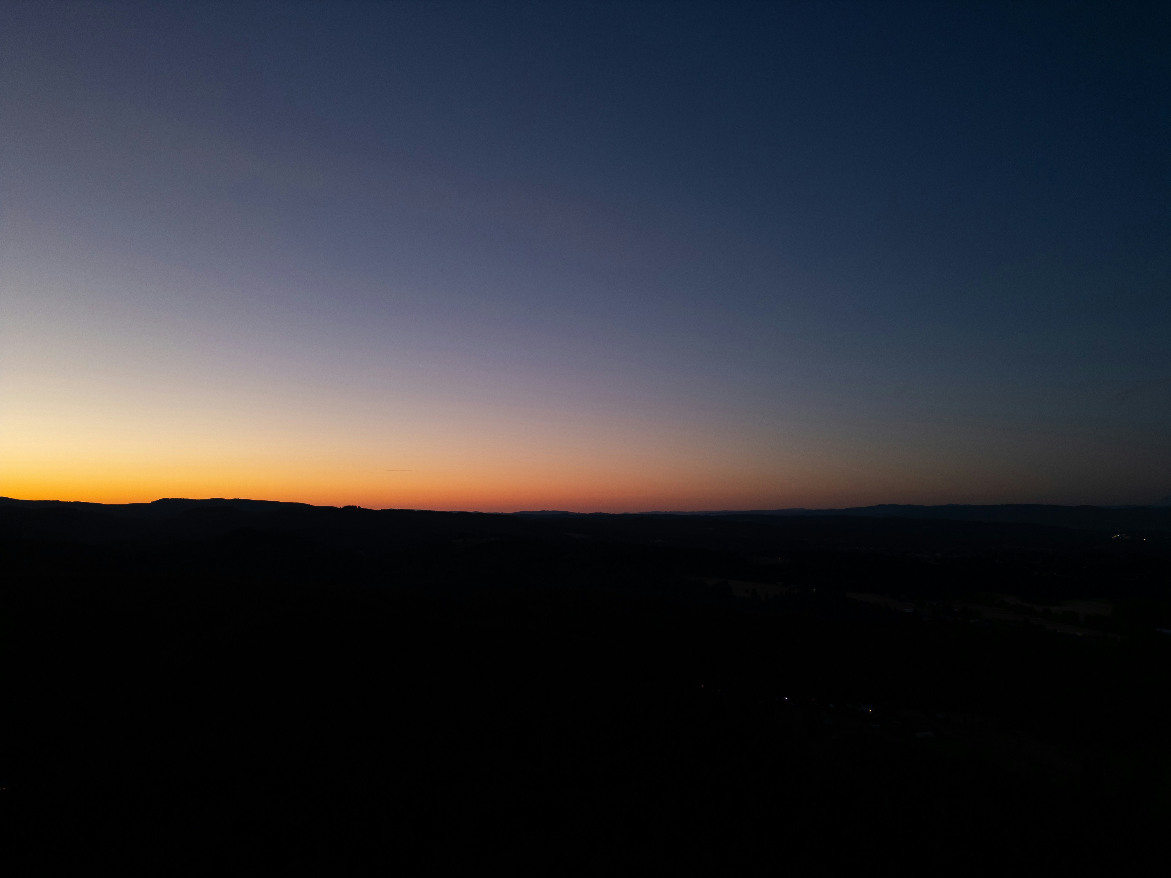 Dawn Slip: A Silent Horizon over Distant Hills