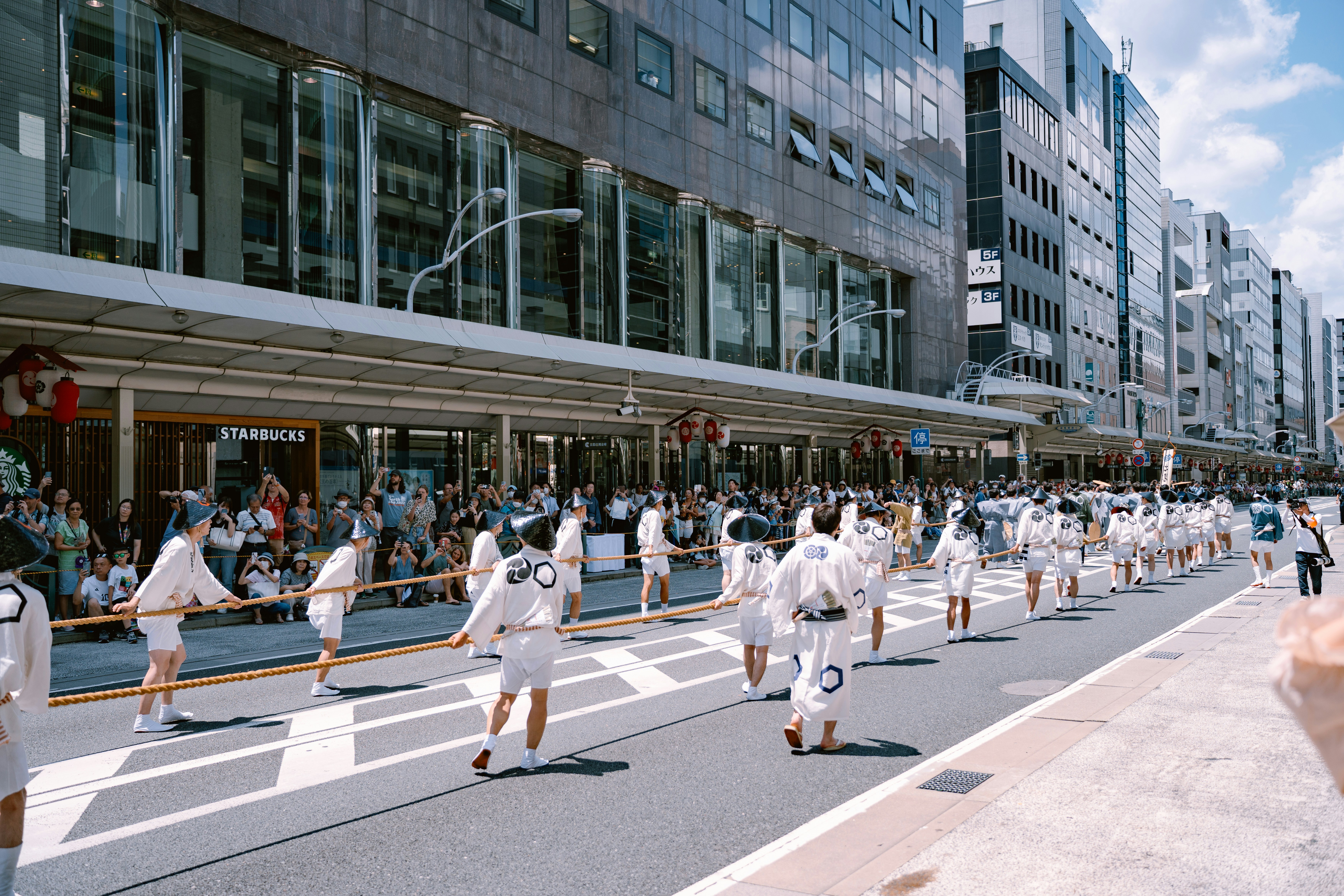 White-Sleeved March Along a Modern City Street