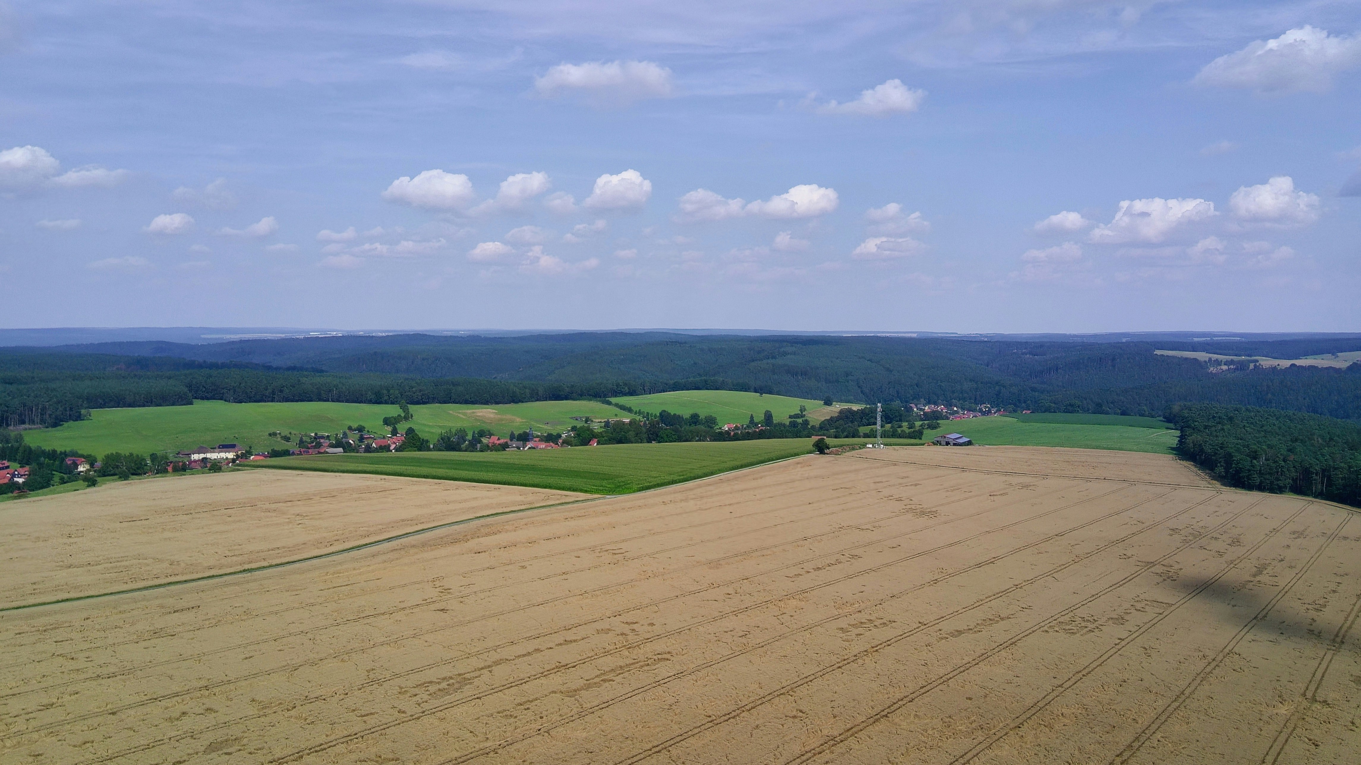 Sunlit Wheatfields Rest Beside a Quiet Village