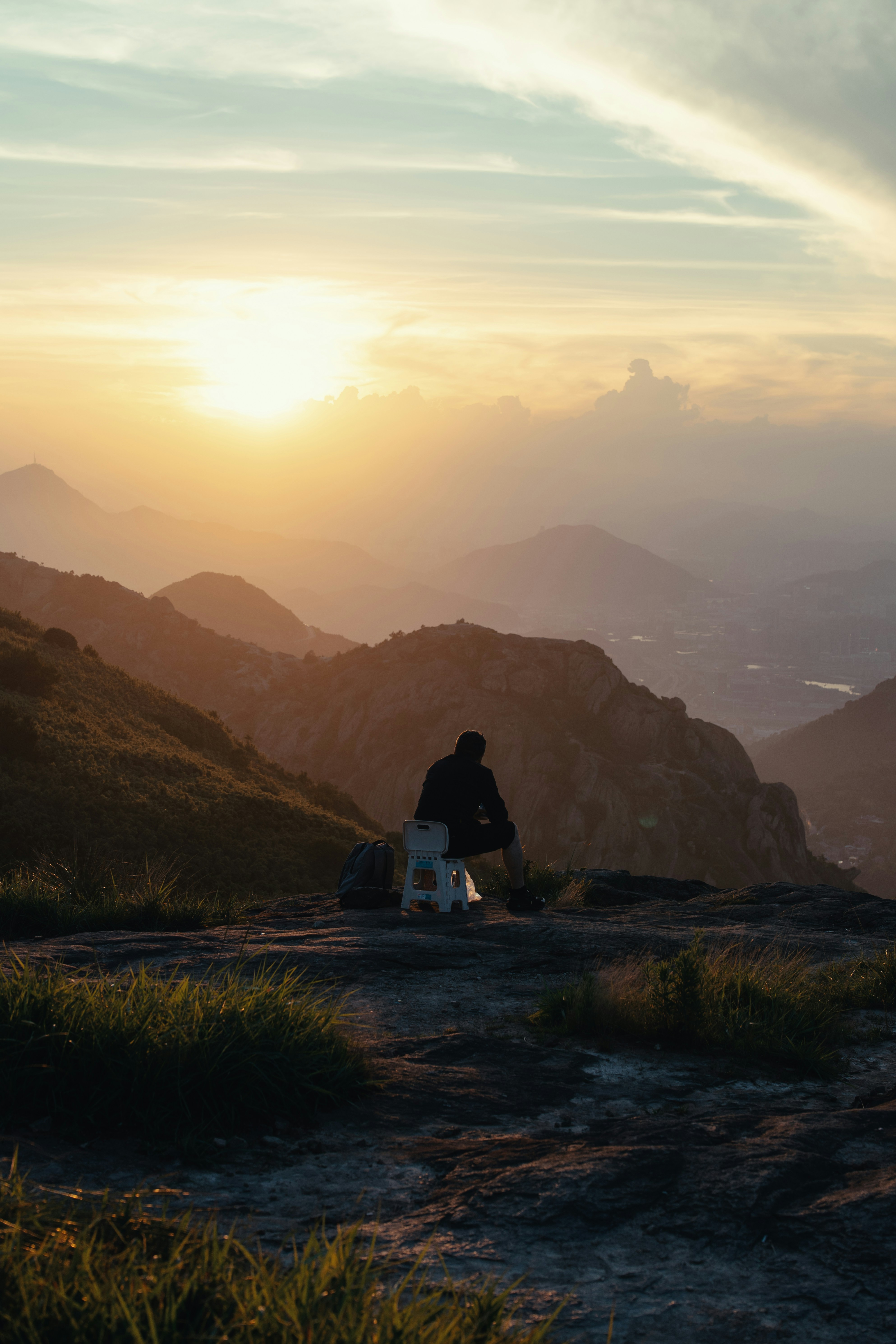 Solitary Rider at the Horizon: Sunrise Over Rugged Peaks