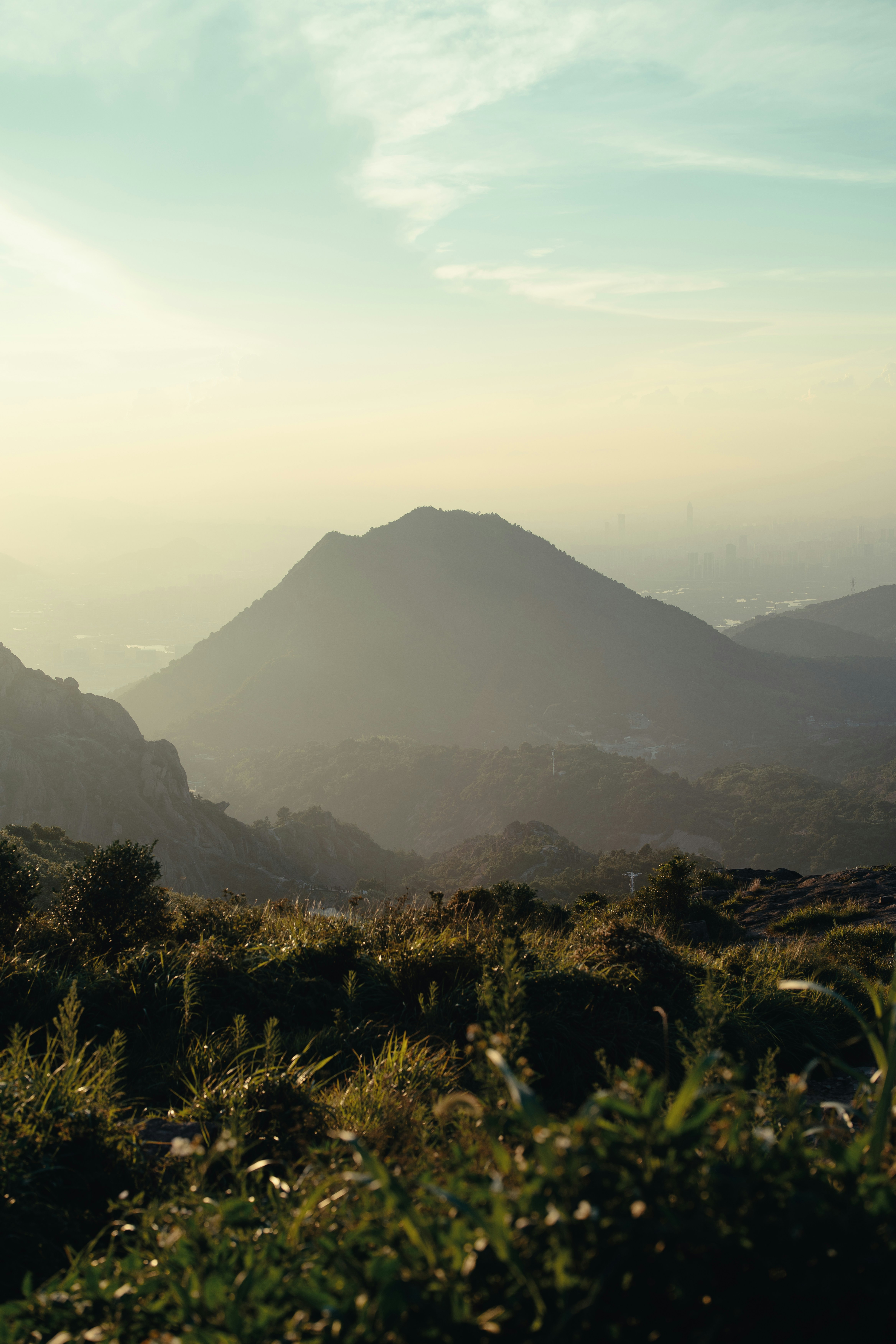Silent Summit: Morning Mist Over the Rolling Hills