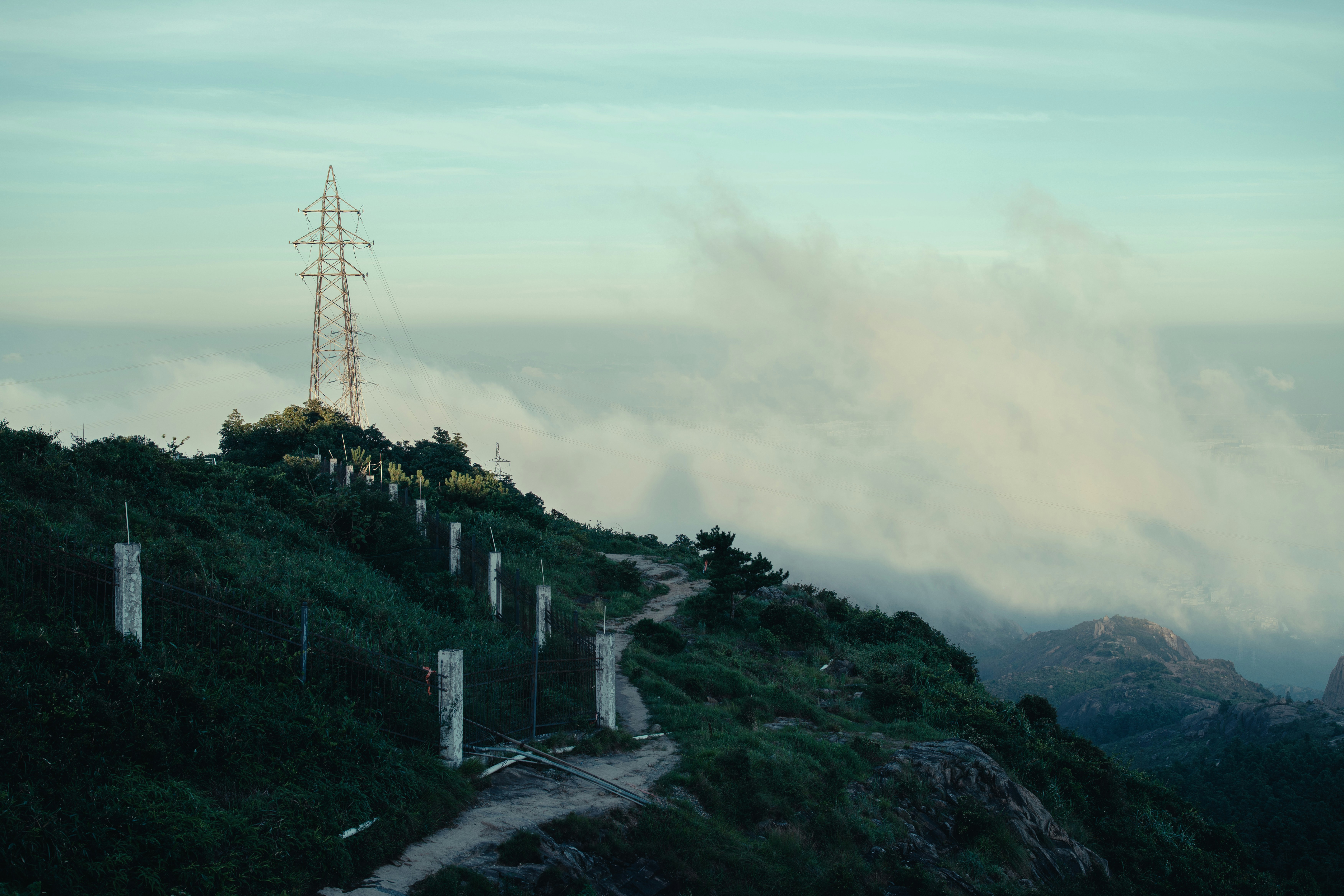 Hilltop Route: A Wind-Swept Ascent Beneath a Skybed of Clouds