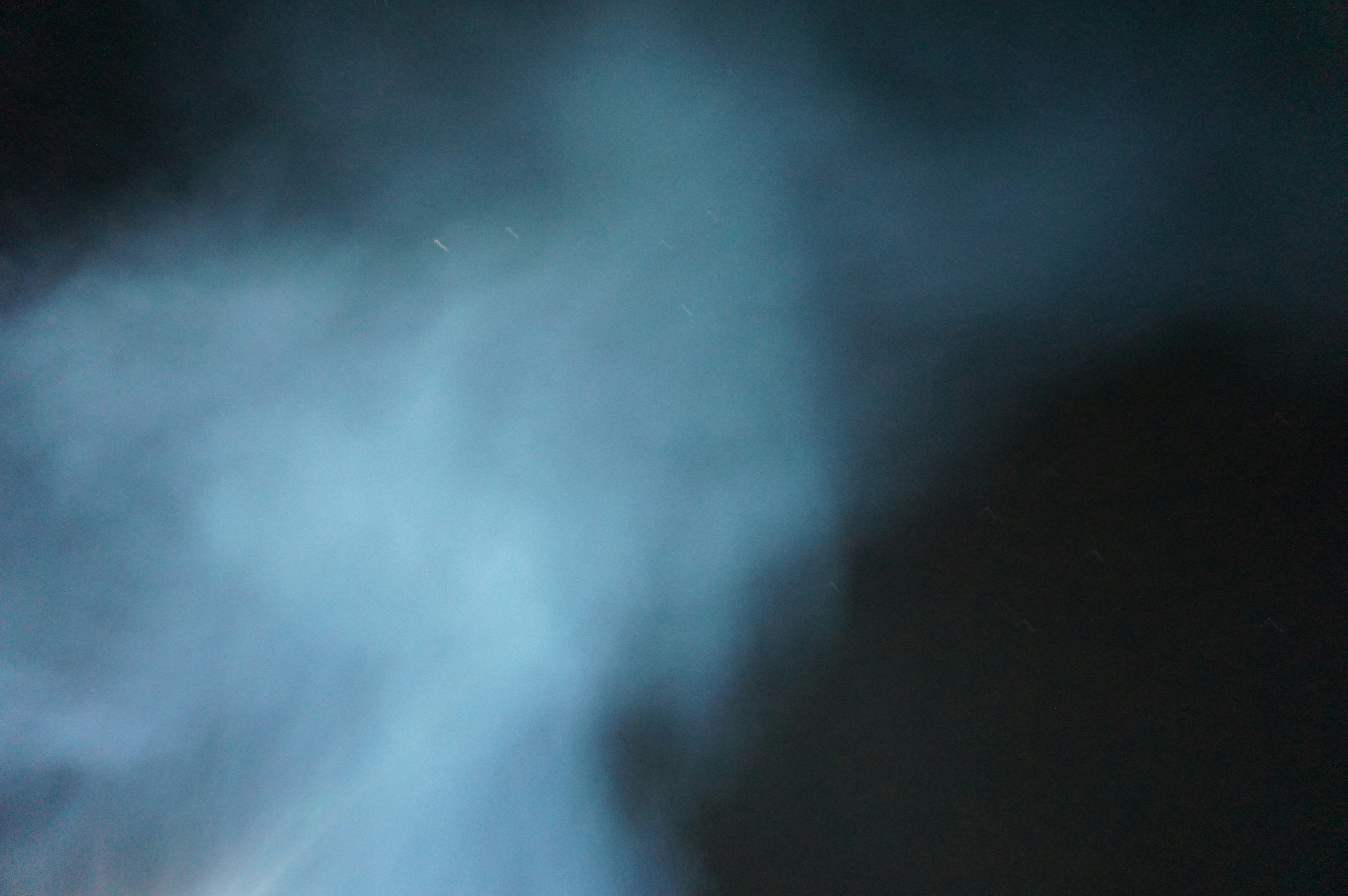 Blue Smoke against Night: A Quiet Push into Darkness