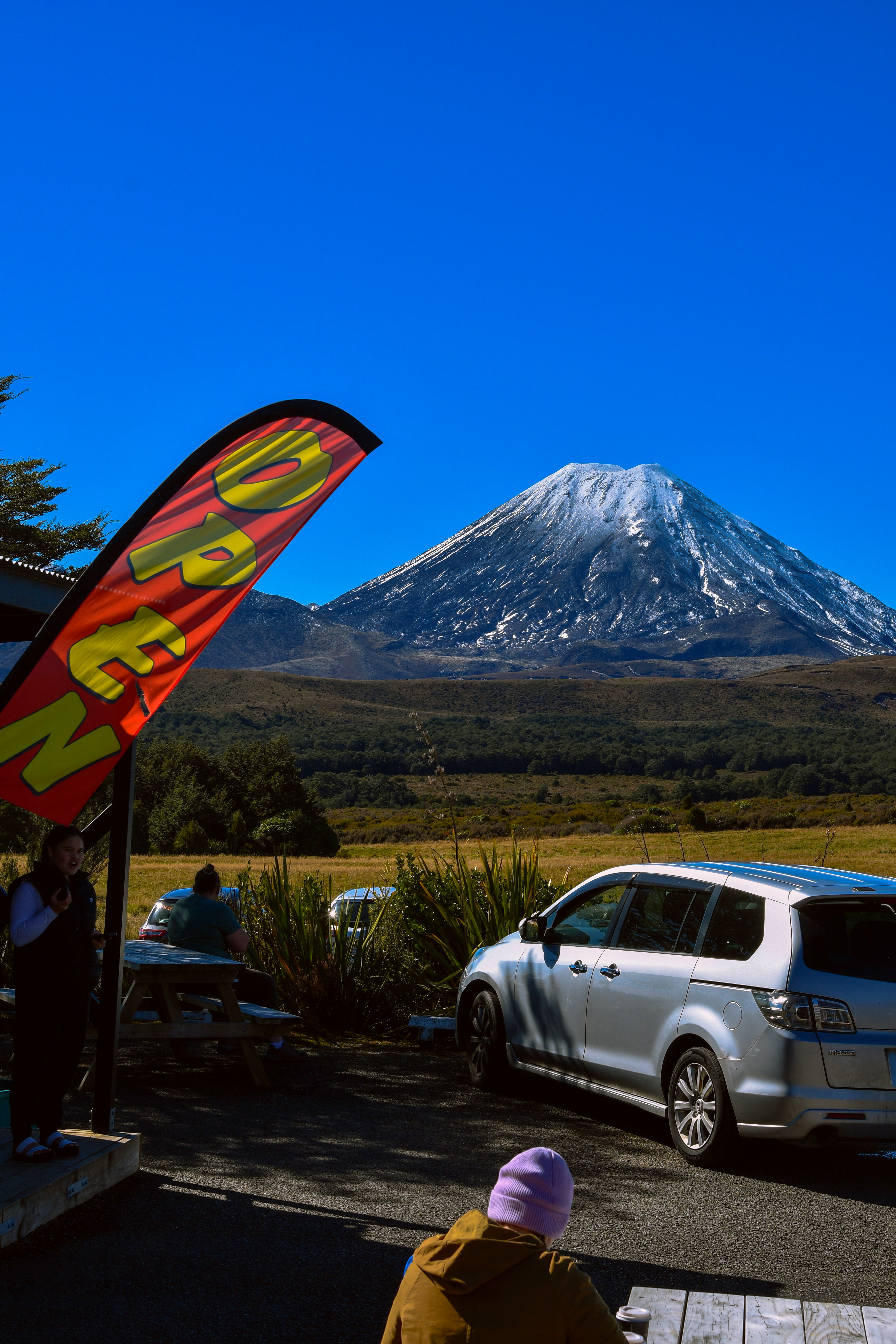 Volcanic Vista Under a Neon Banner