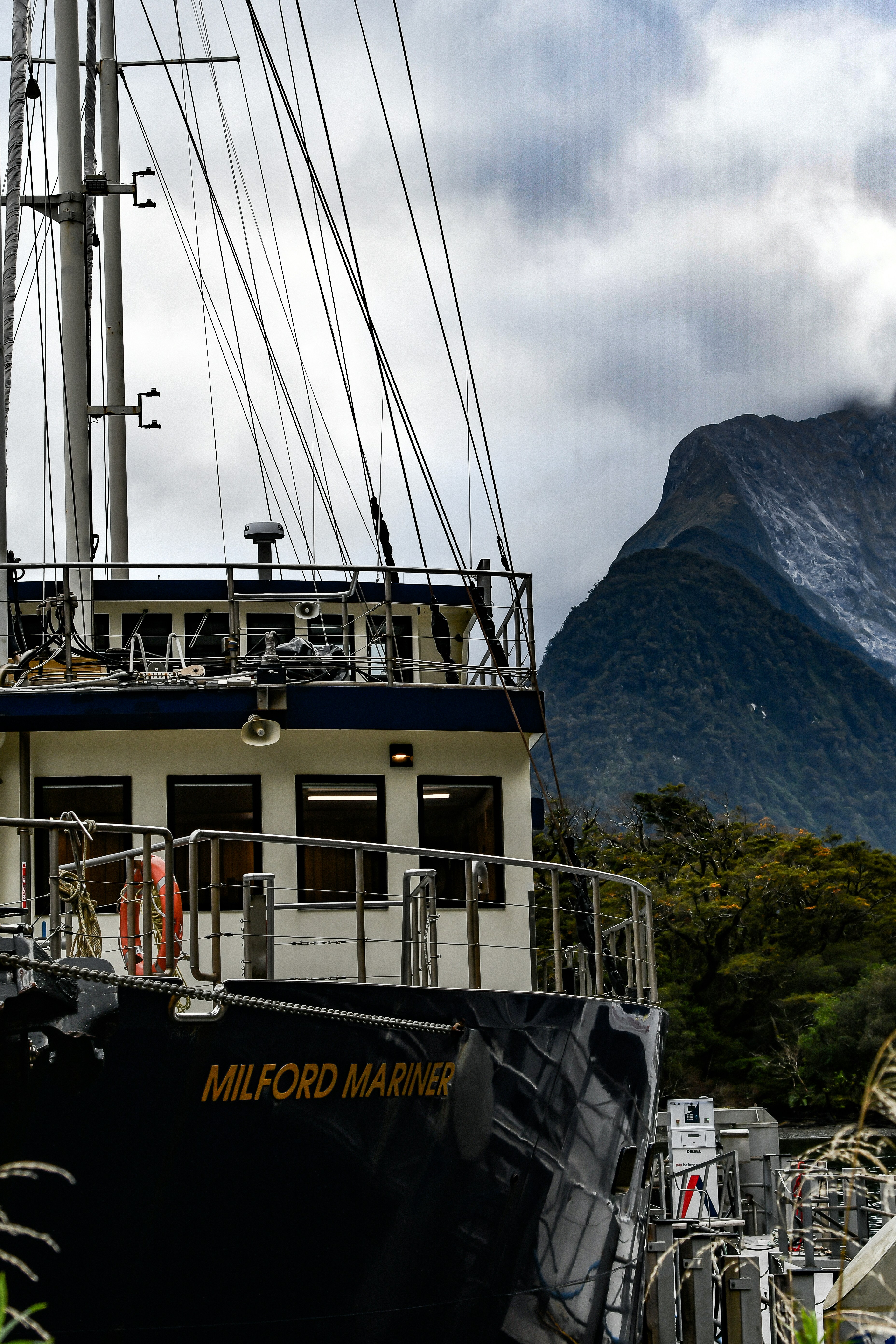 Milford Bow: A Vessel Anchored Against Towering Peaks