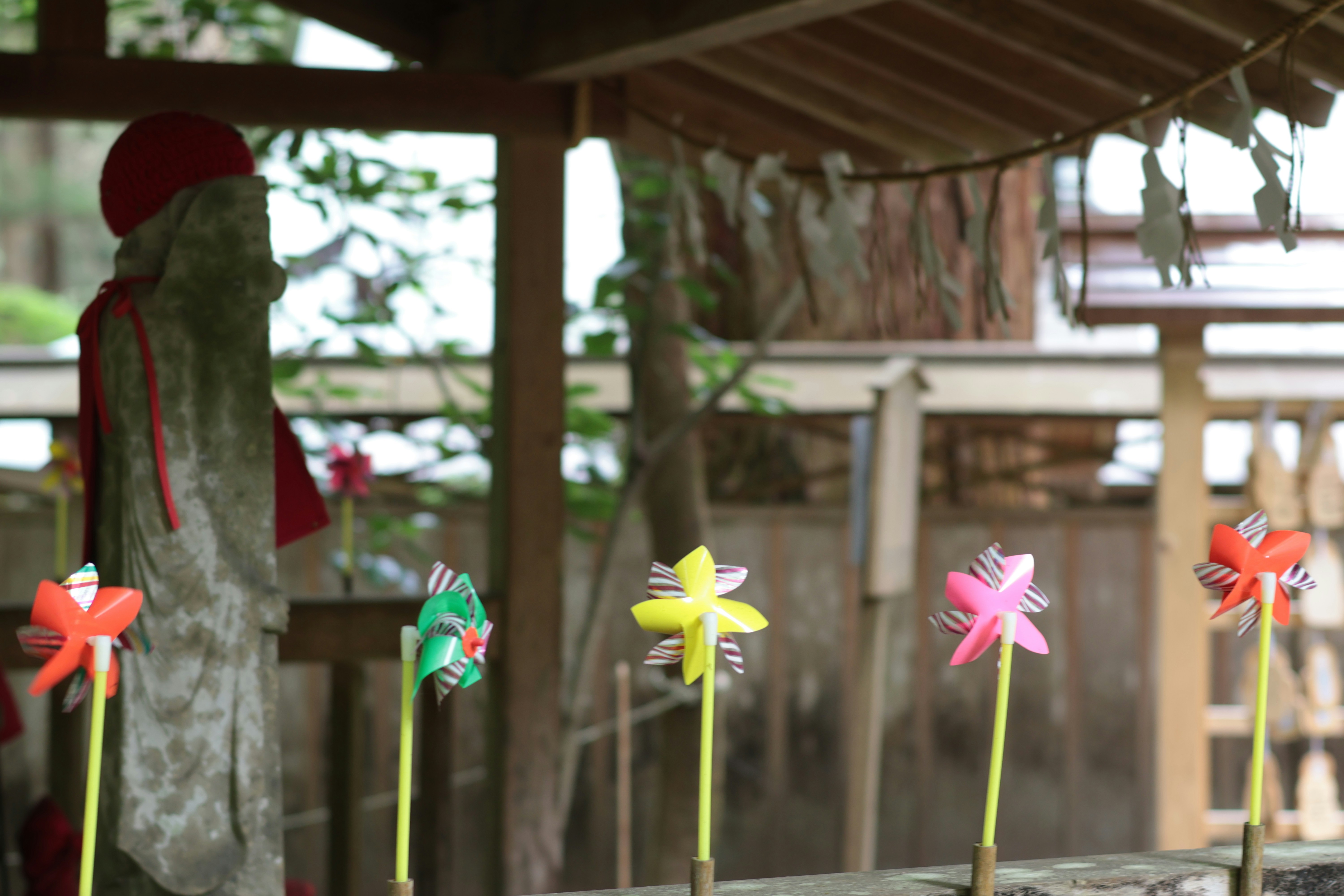 Colorful Wind-Turbine Flowers in a Dim Shrine Scene