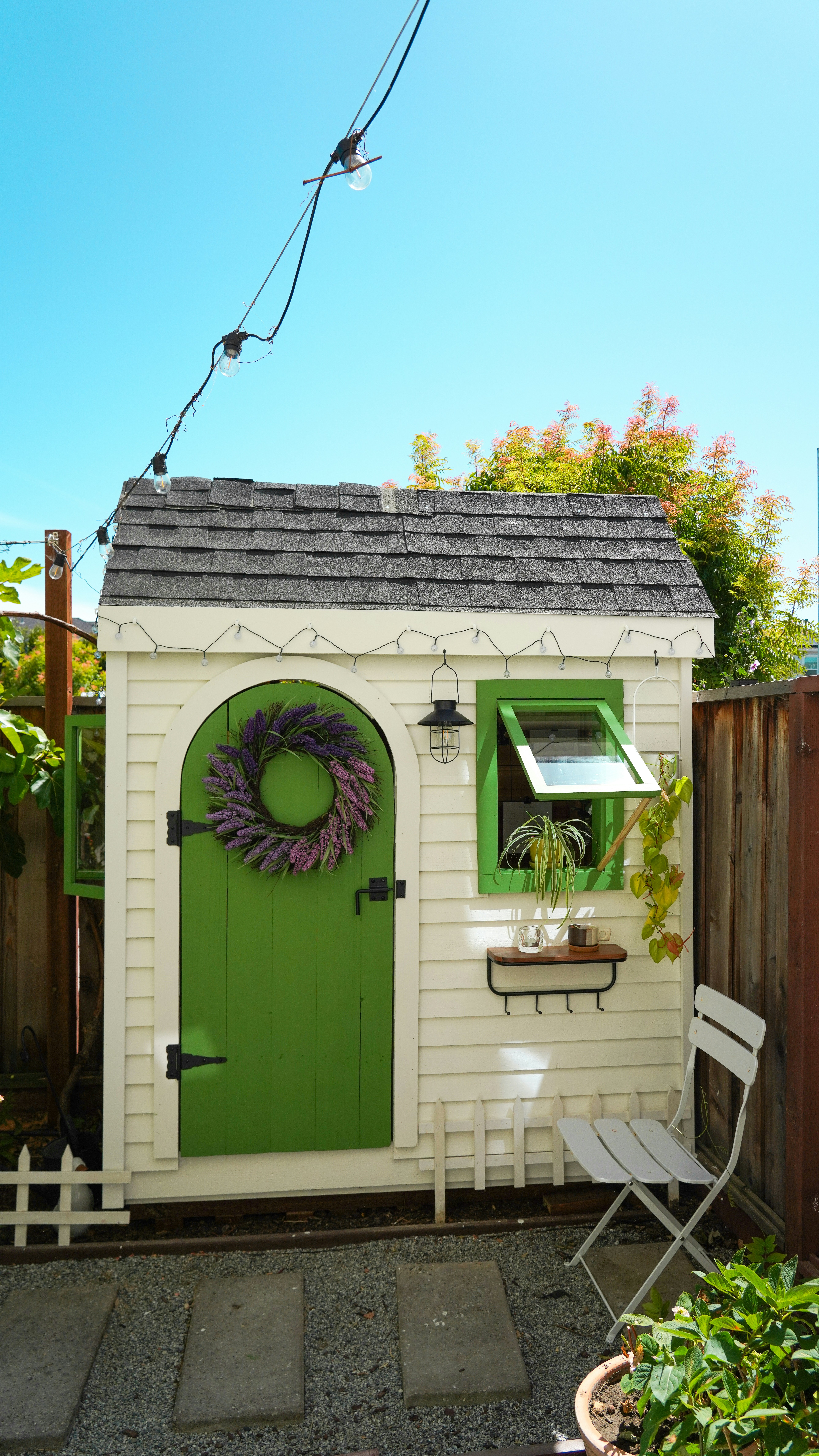 Green Doorway Garden Shed Under String Lights