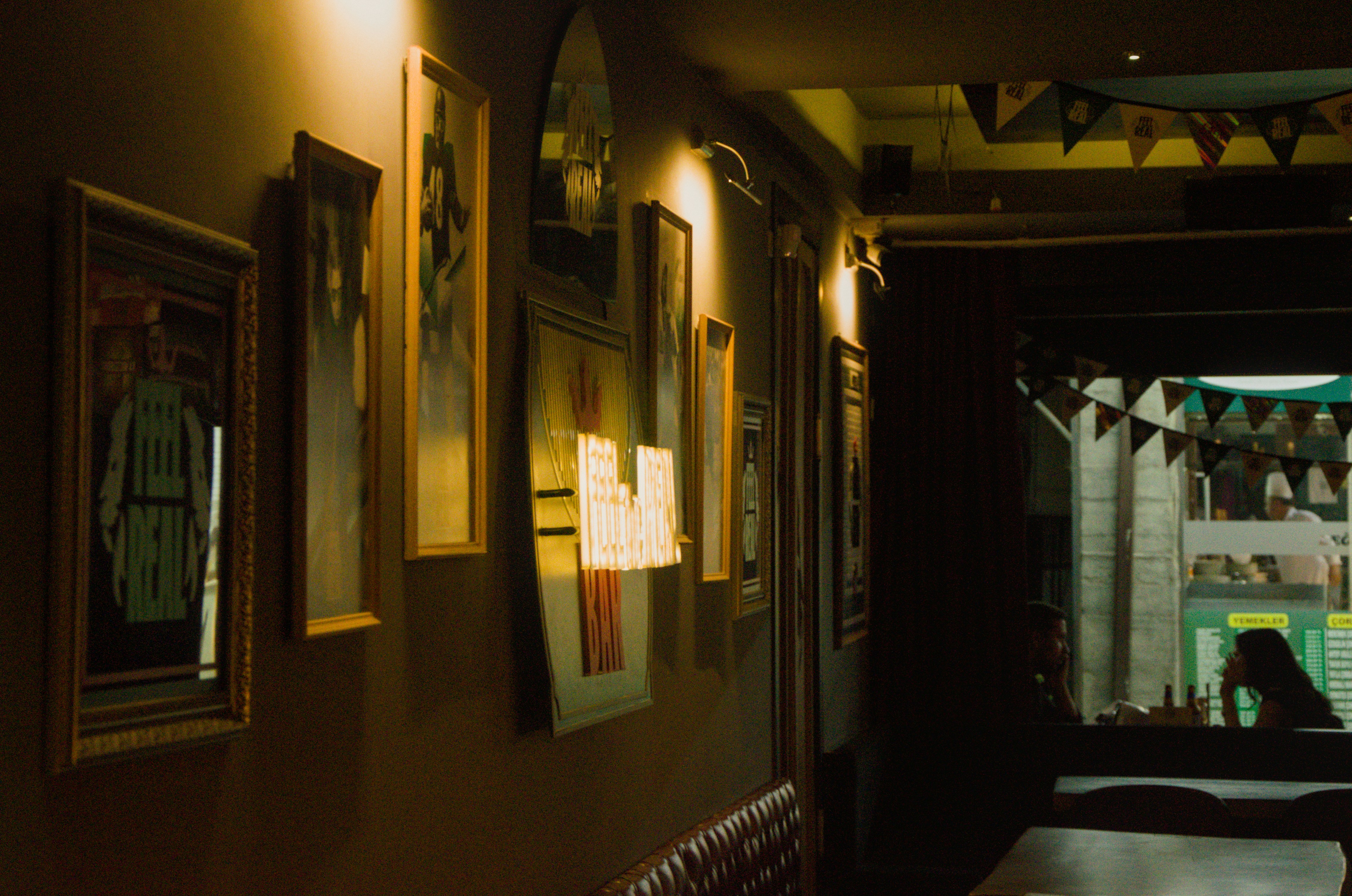 Dim Gallery Corridor with Framed Art and Soft Light