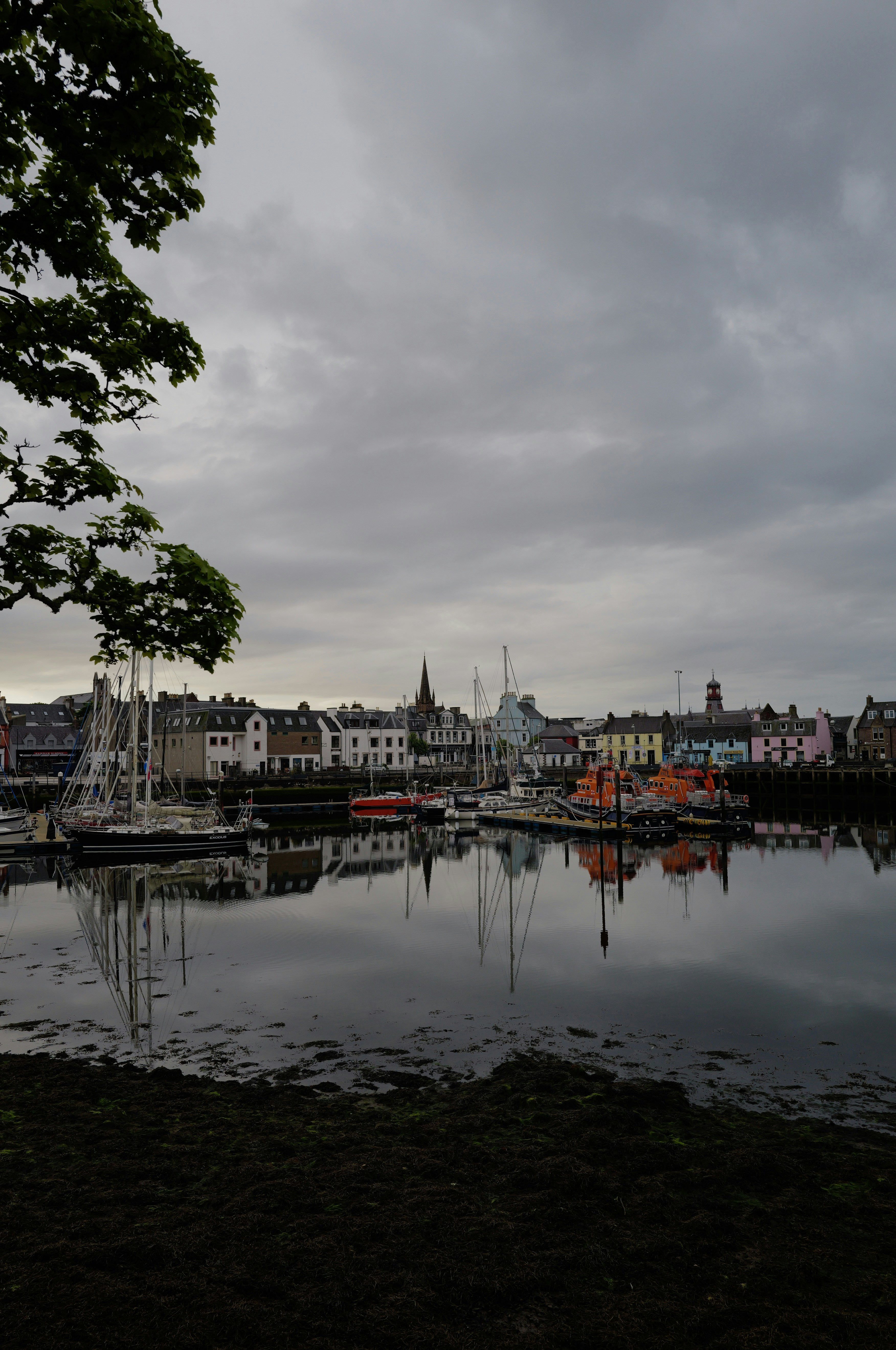Harbor town at dusk: mirrored sails and pastel cottages