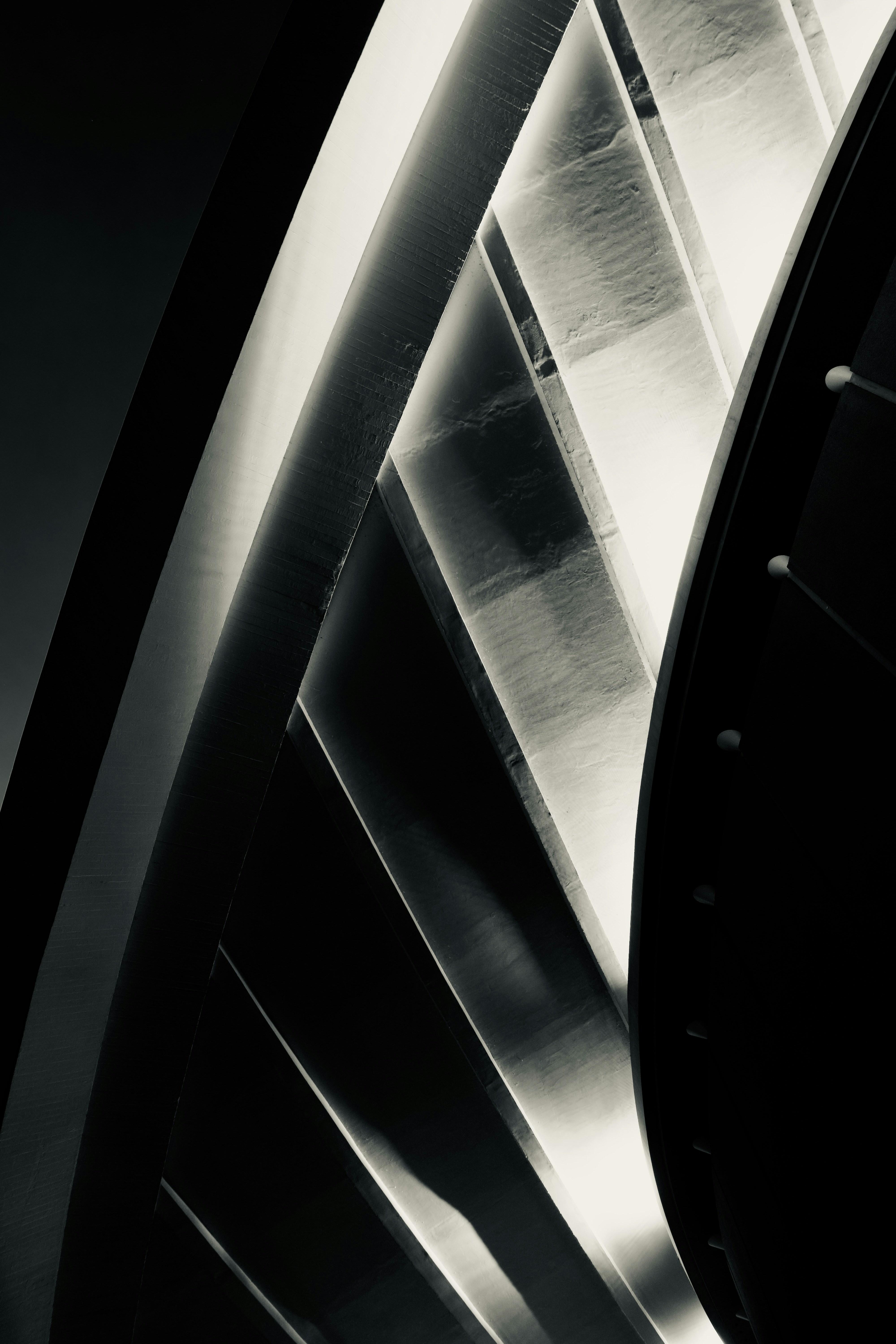Interwoven Light: Elliptical Strata in Steel and Shadow