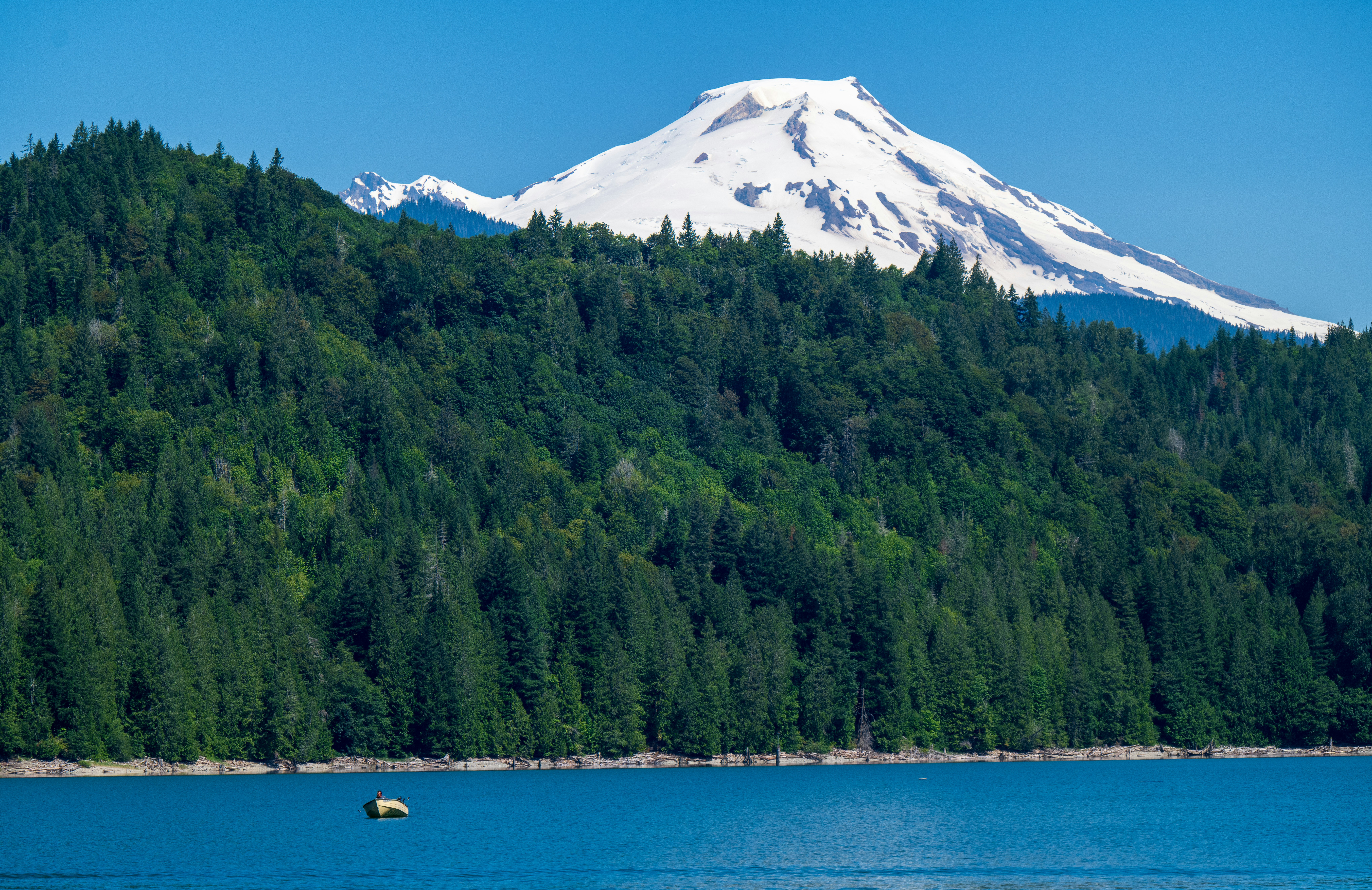 Snow-capped Peak Beyond a Tranquil Blue Lake