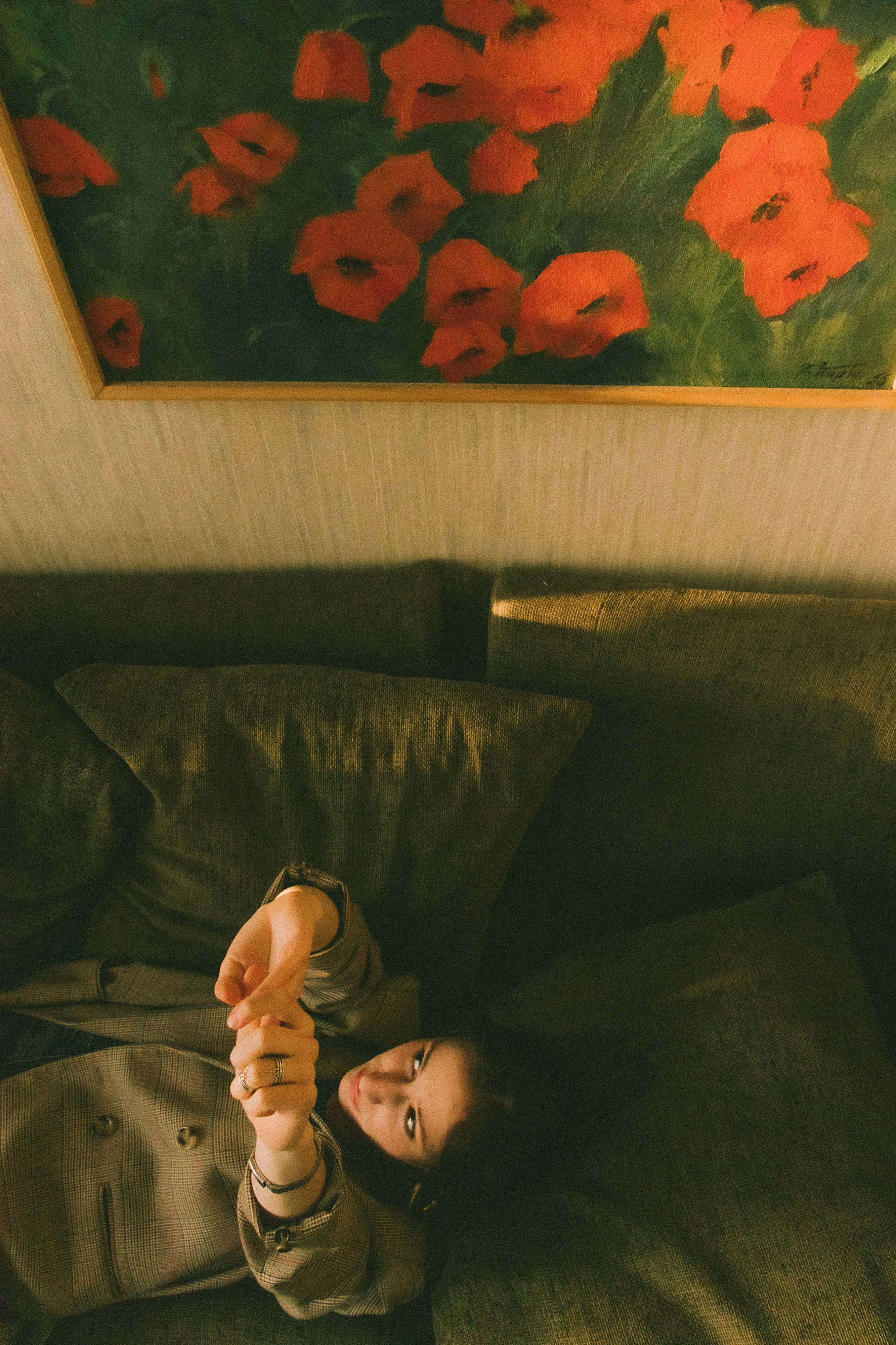Thumbs Up from the Couch: A Quiet Moment with Red Poppies Above