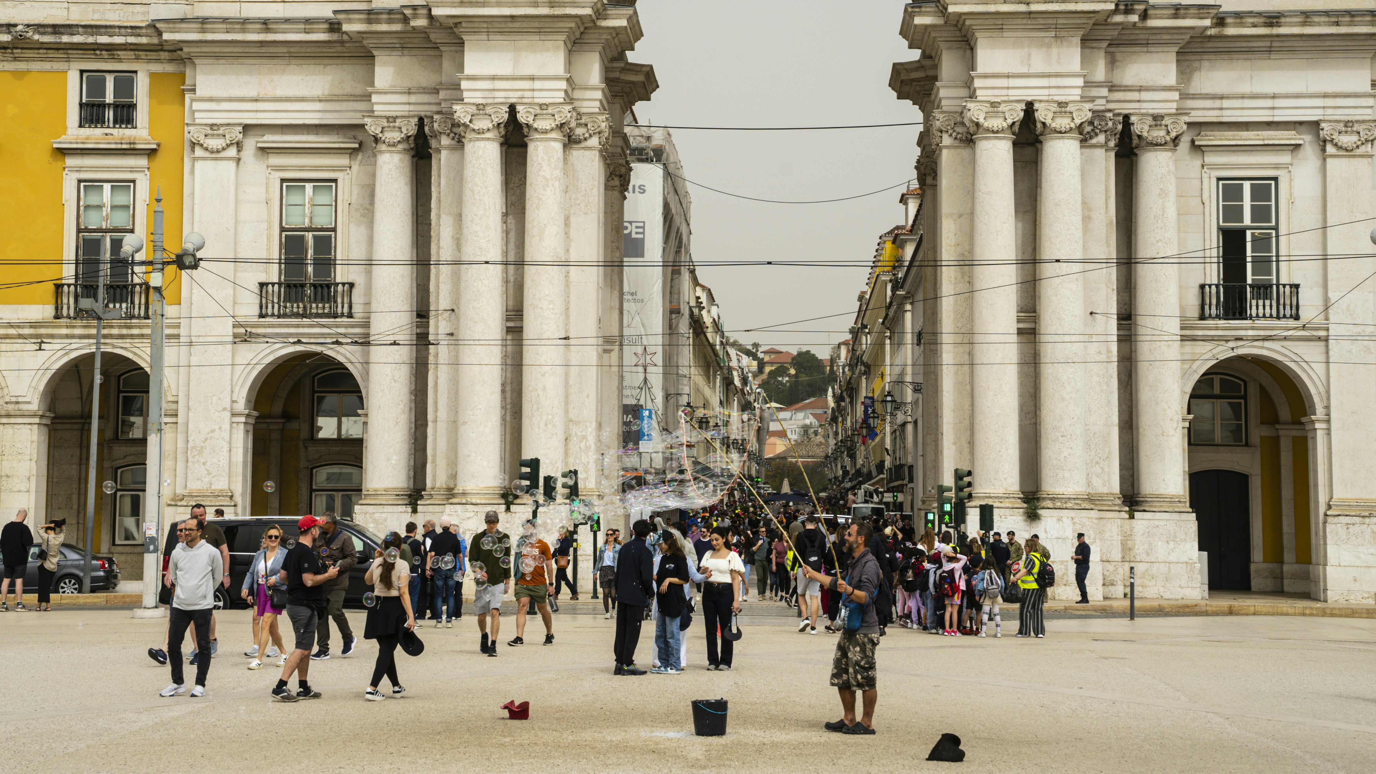 Gateways and Gathering: People Crossing the Archway Courtyard
