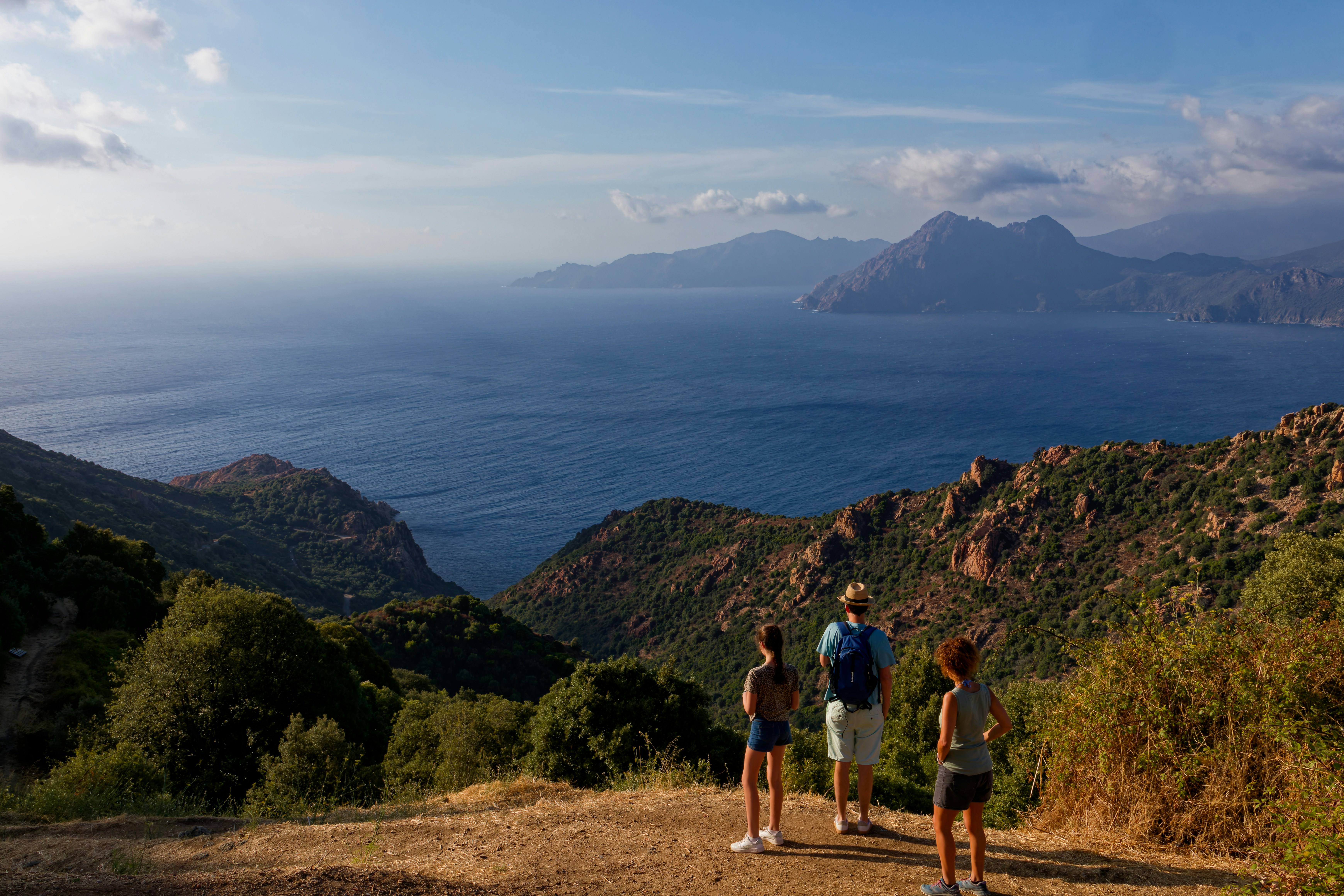 Overlook at the Sea Cliffs: Travelers Pause at Sunset
