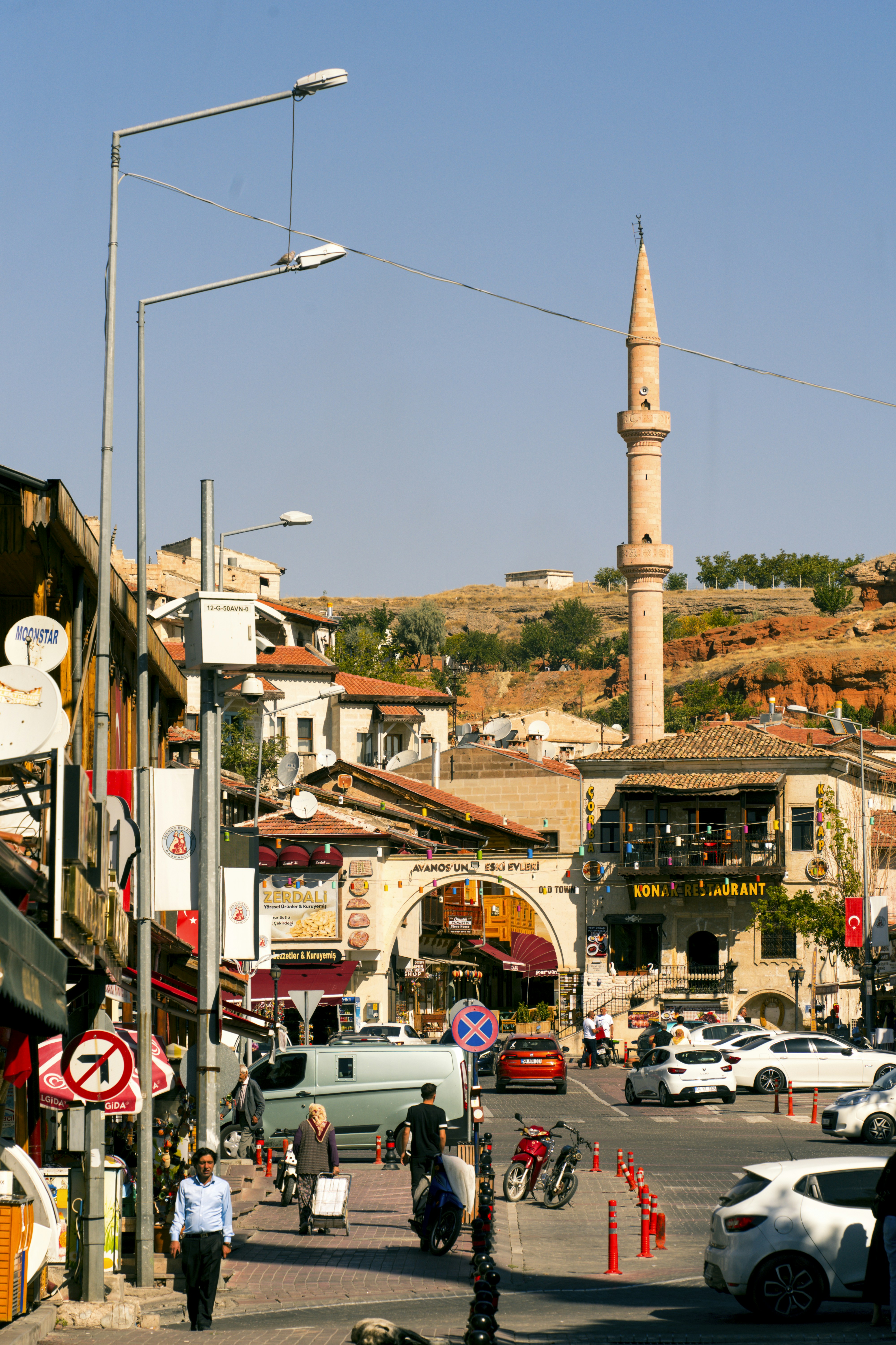  Alleyway Pulse: Street Life Beneath a Minaret
