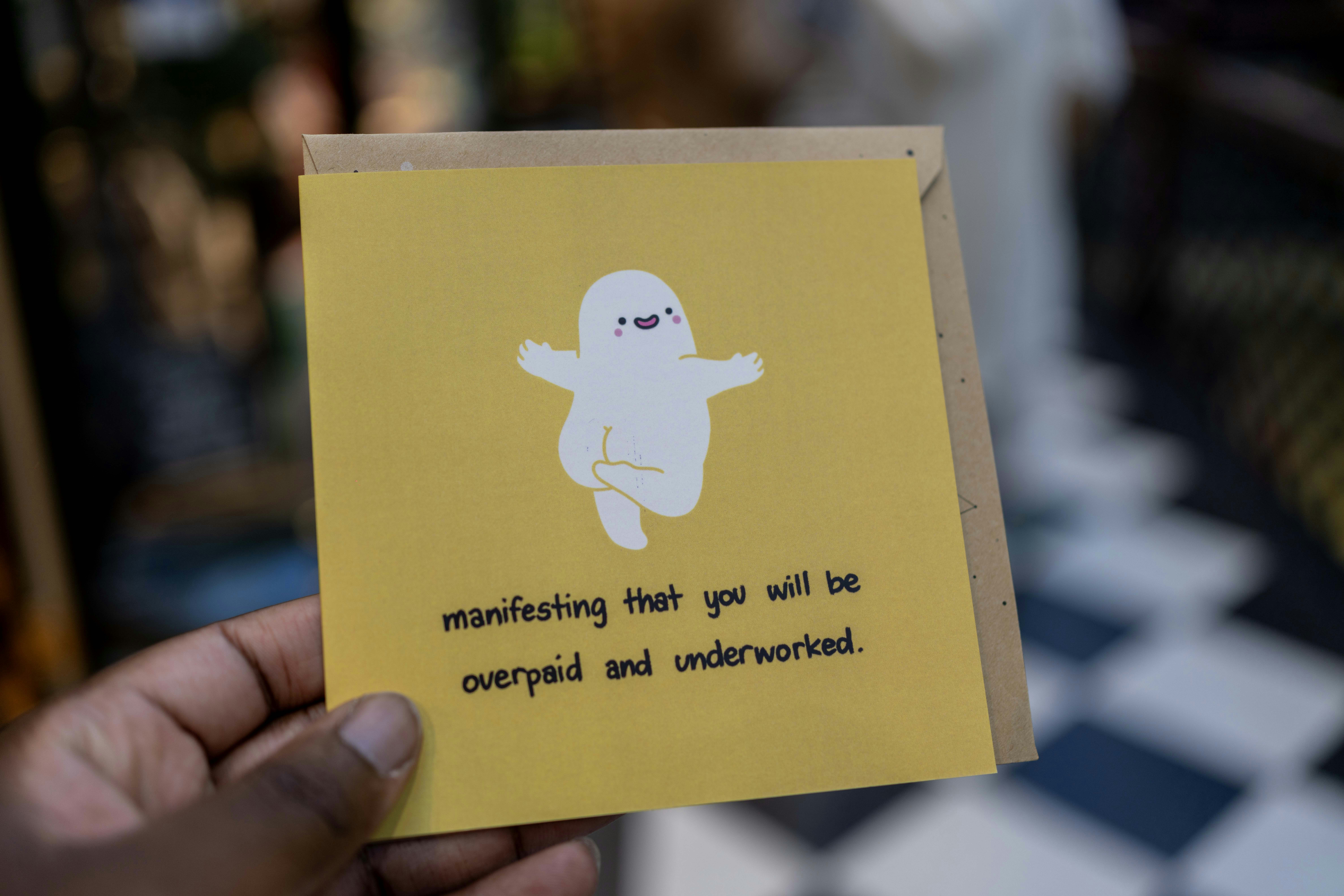 Yellow Card of Whimsy: A Handheld Card with a Friendly Ghost
