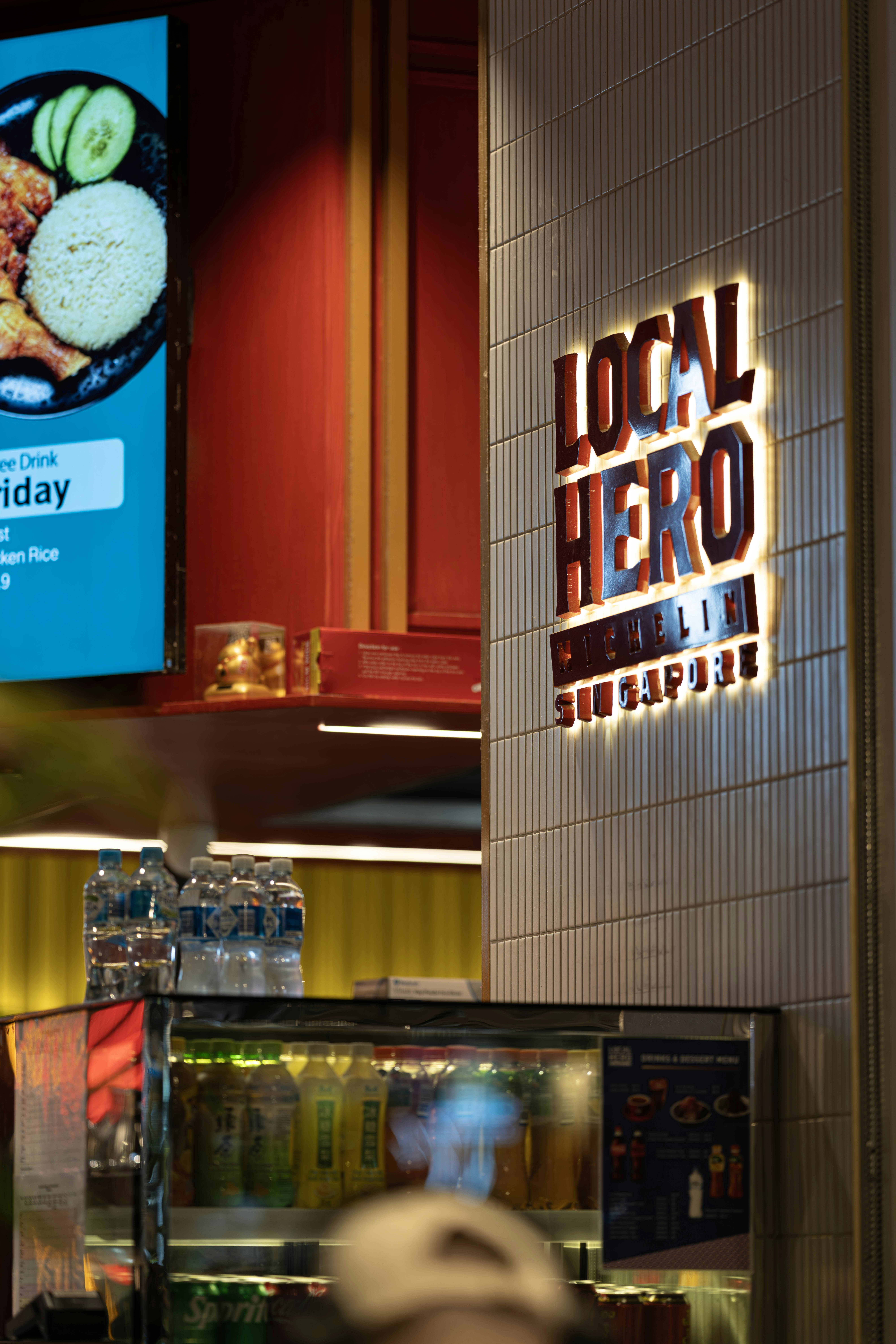Local Hero Signage Illuminates the City’s Night Plate