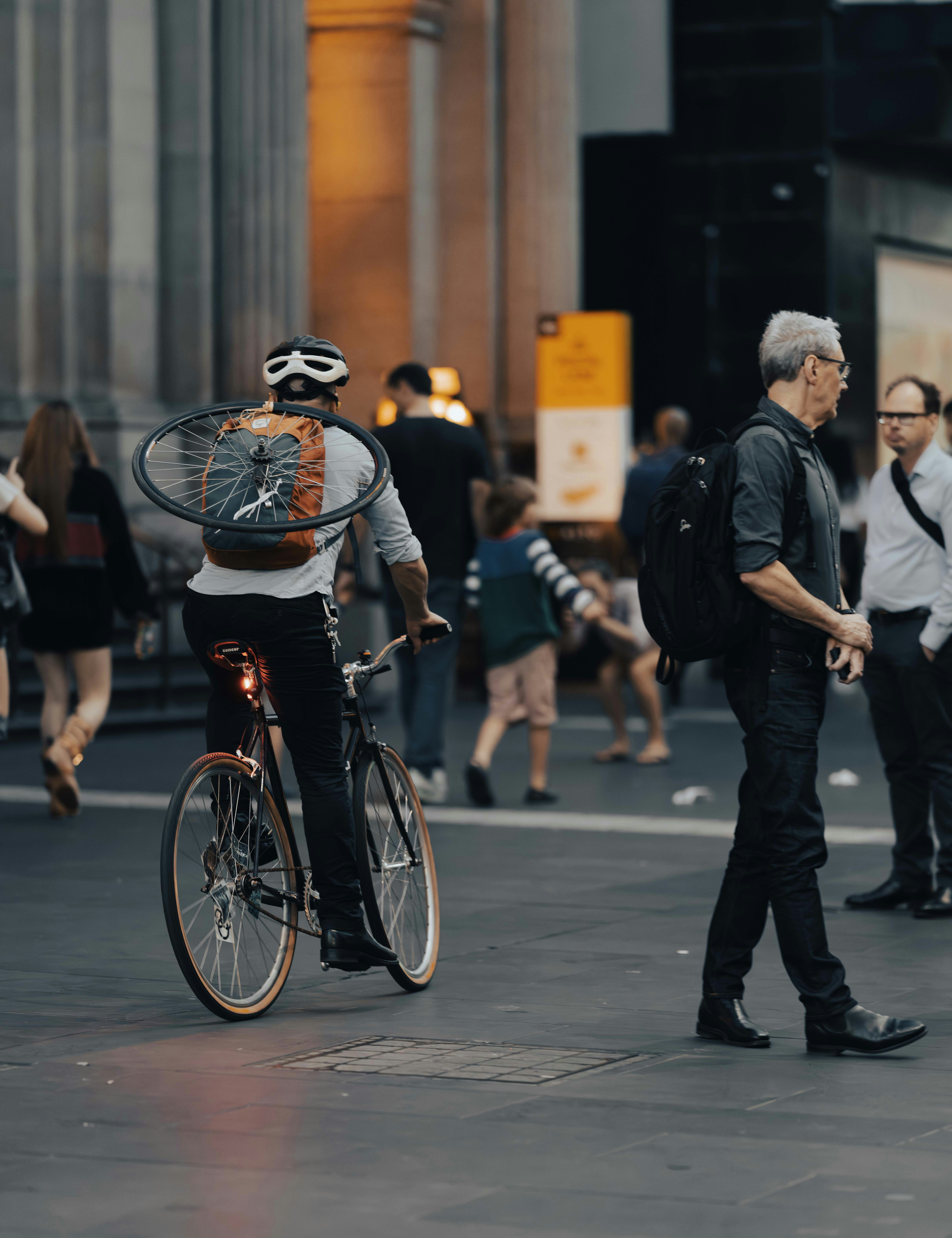 Cyclist with a Spare Wheel: Urban Passage in Motion