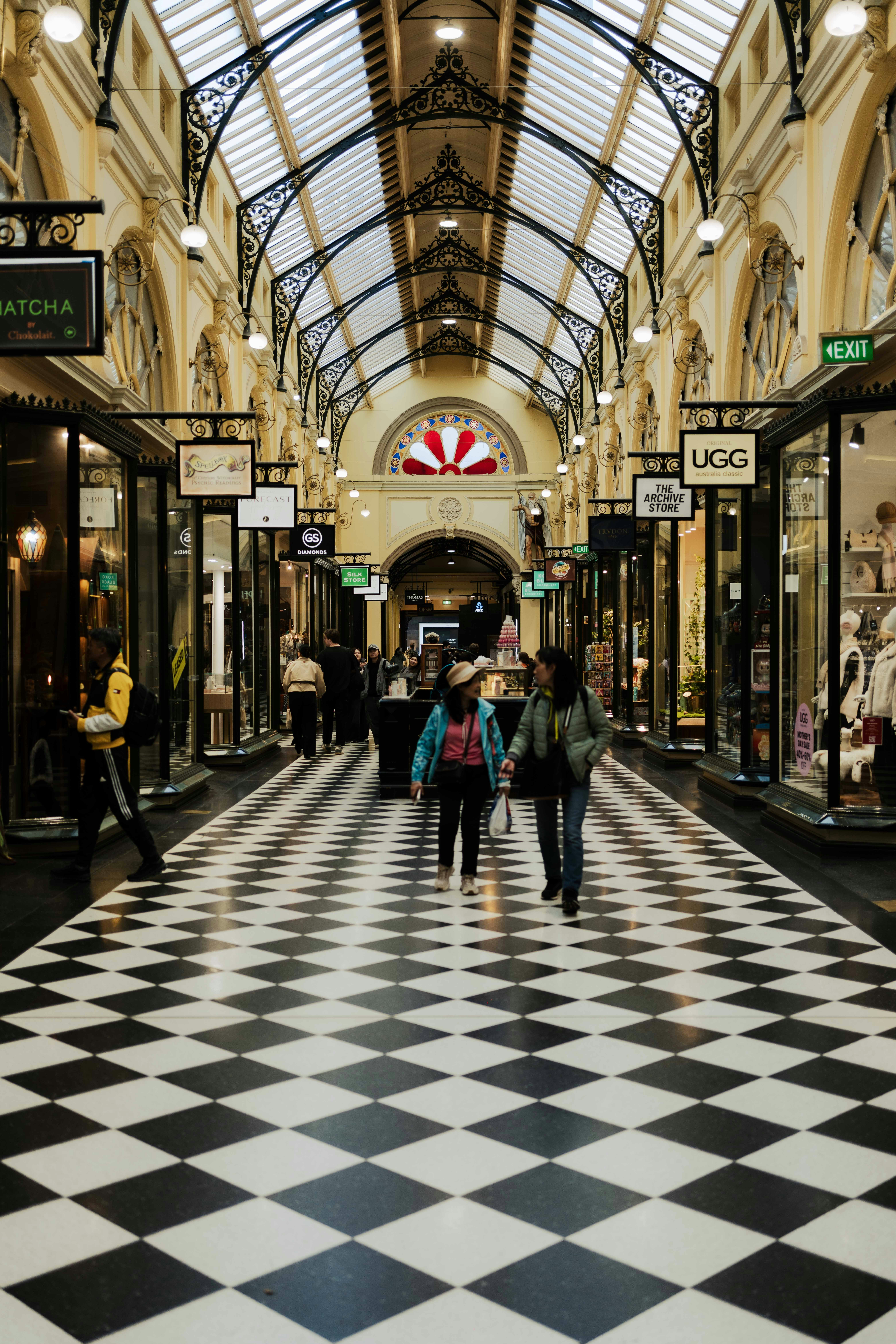 Symmetry in the Arcaded Market: People Walk the Checkerboard Aisle
