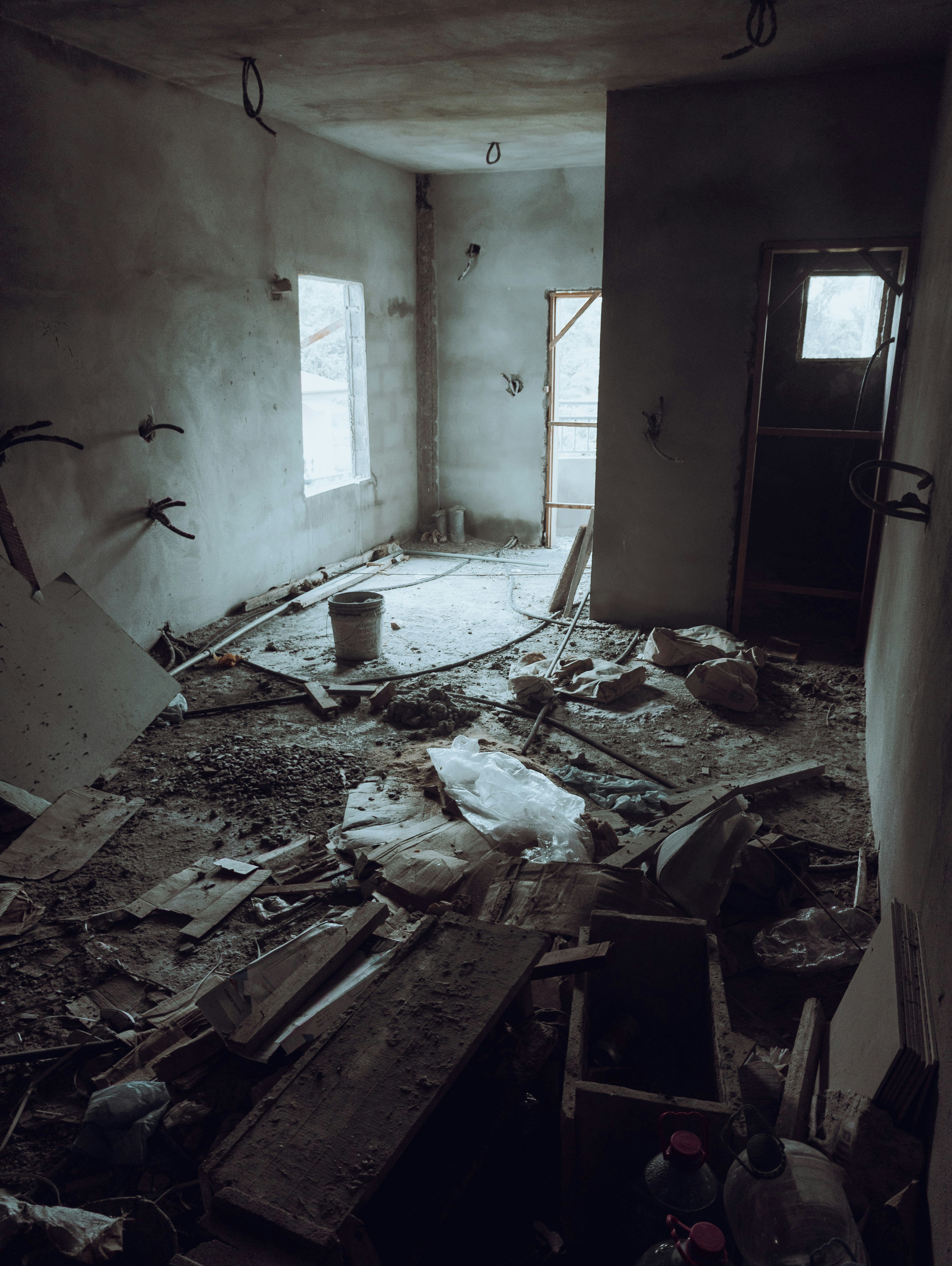 Construction Chaos: A Dim Room Under Renovation