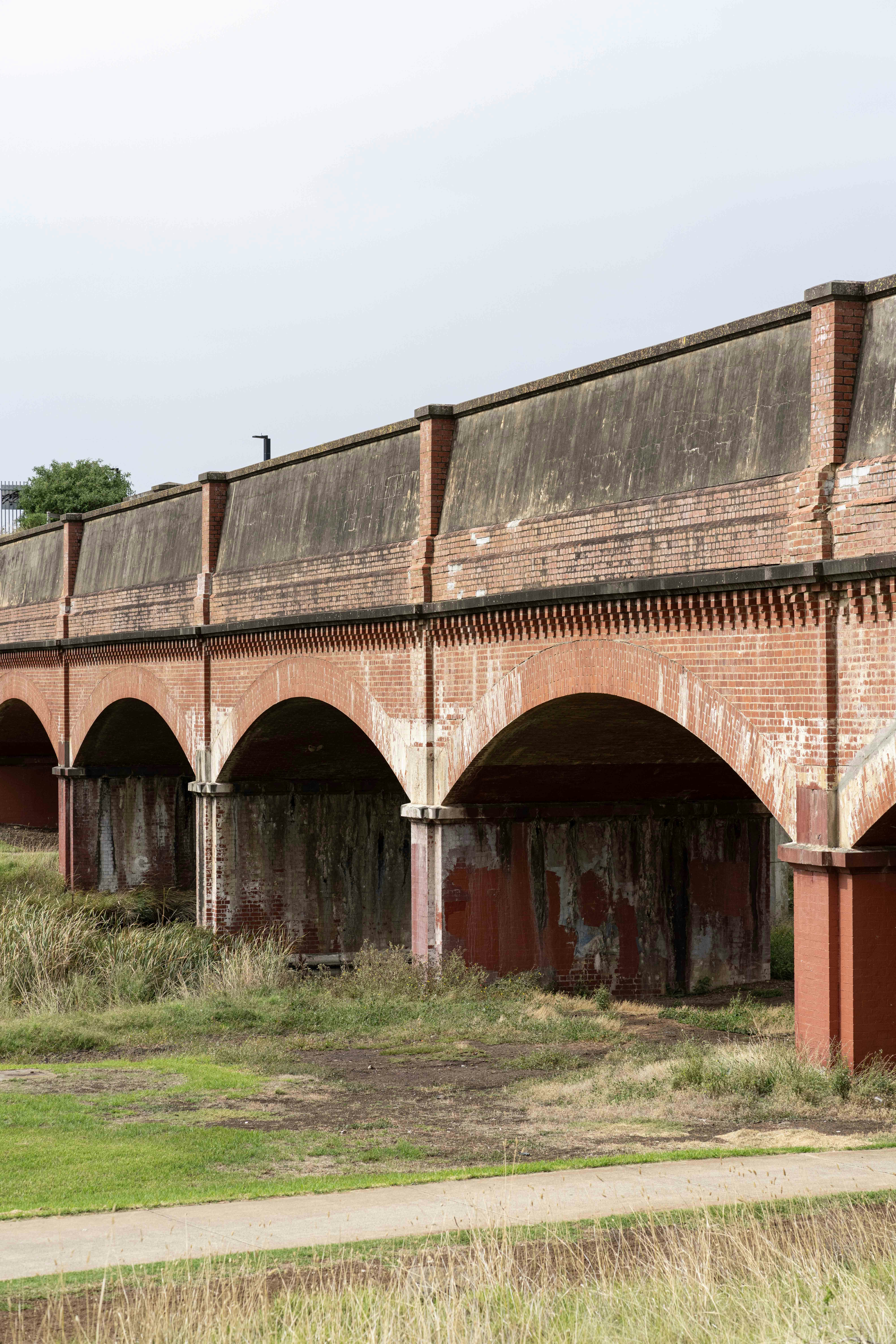 Brick Arches and Weathered Facade: A Quiet Industrial Span