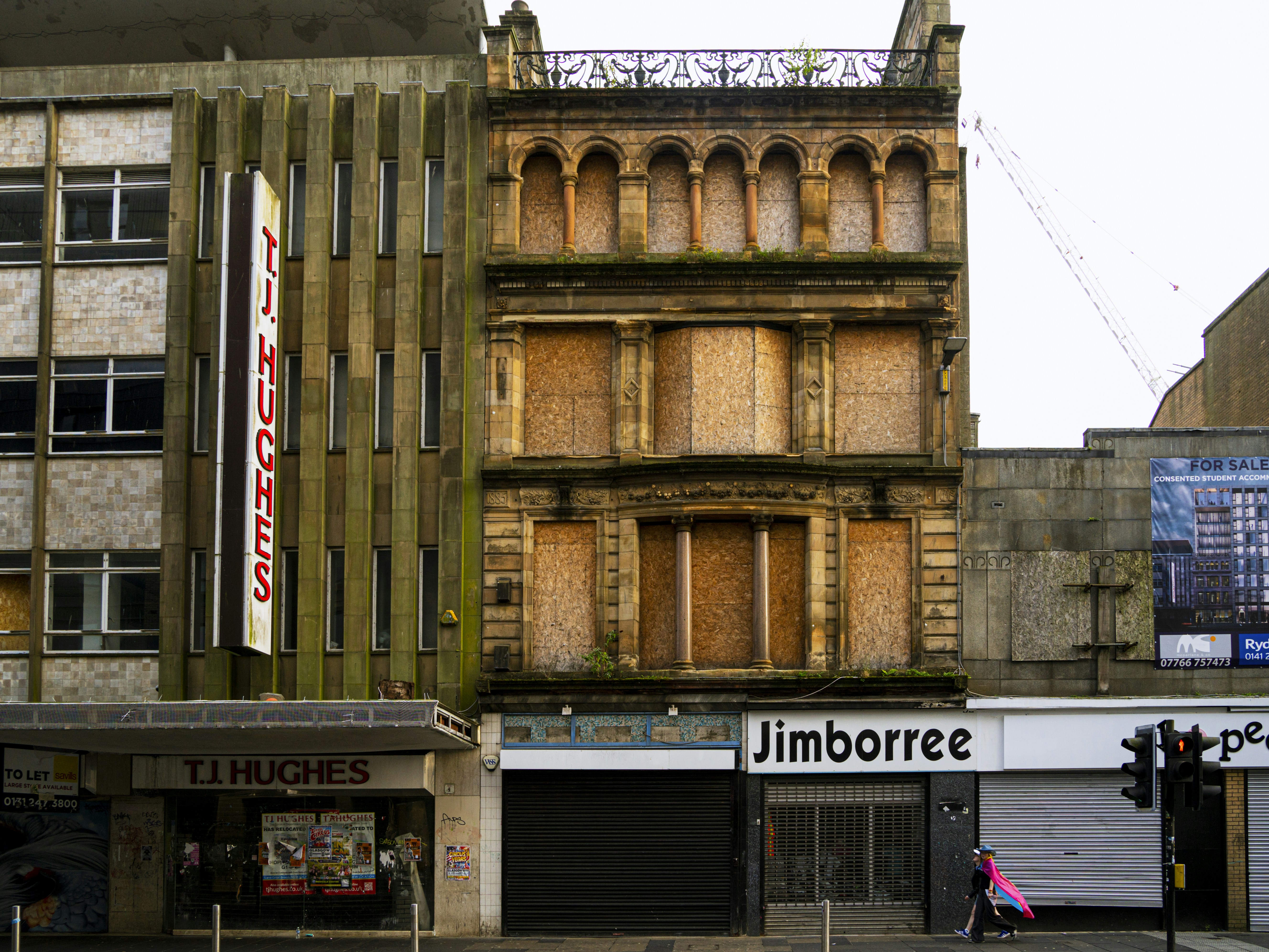 Abandoned Facade and Closed Shops on a City Street