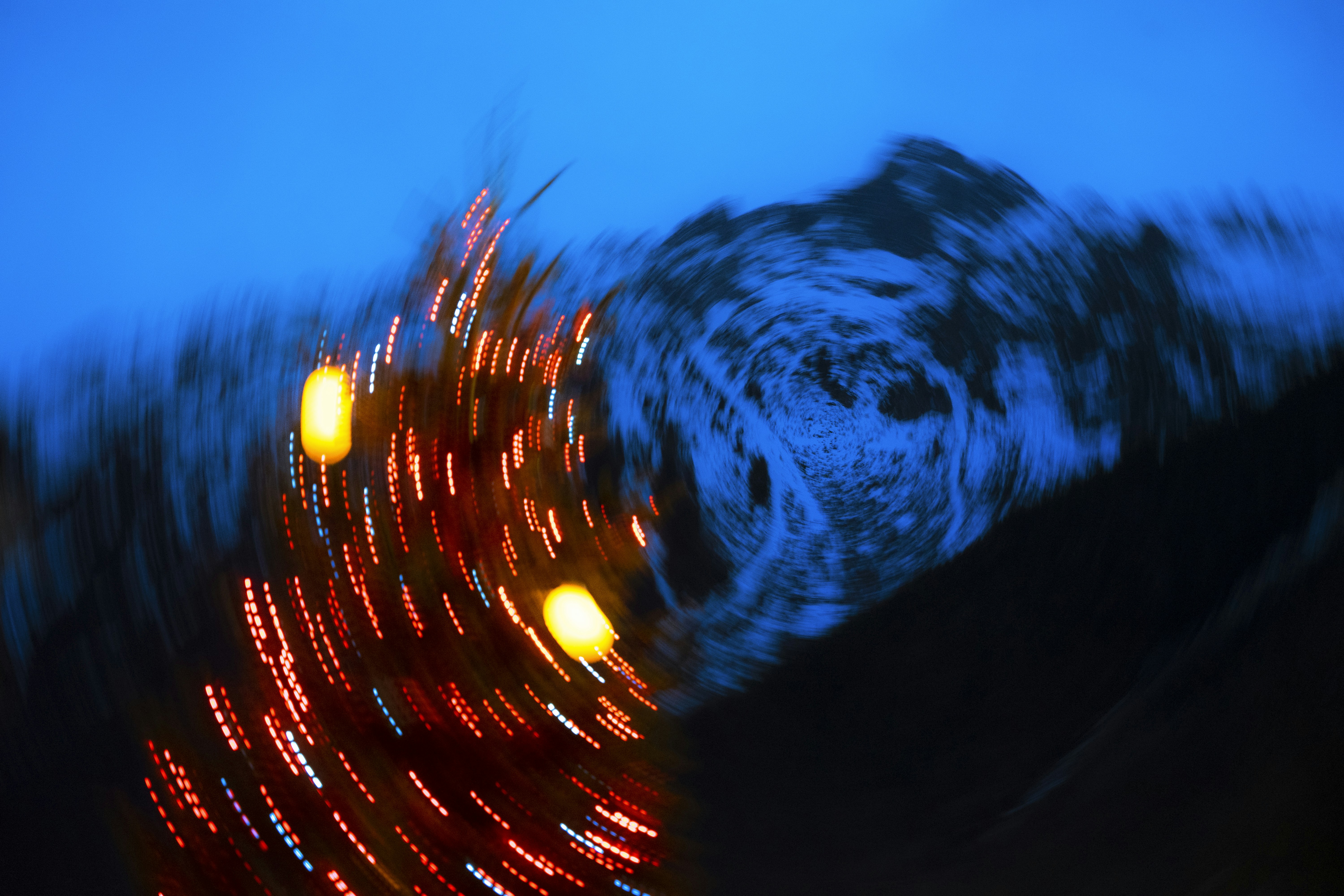 Night Blur: Christmas Lights in a Blue Hour Spiral