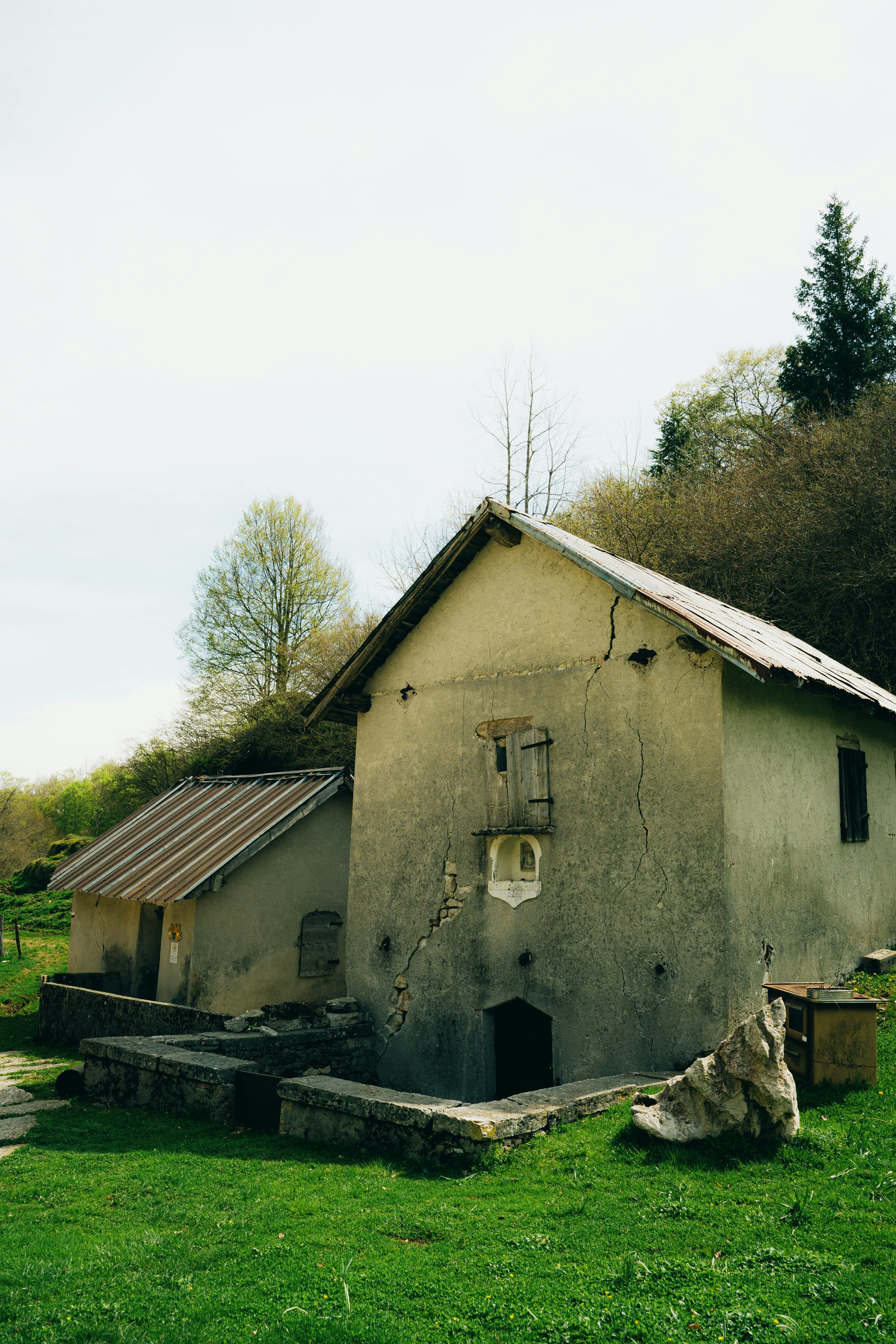 Weathered Cottage Rising from Green Fields
