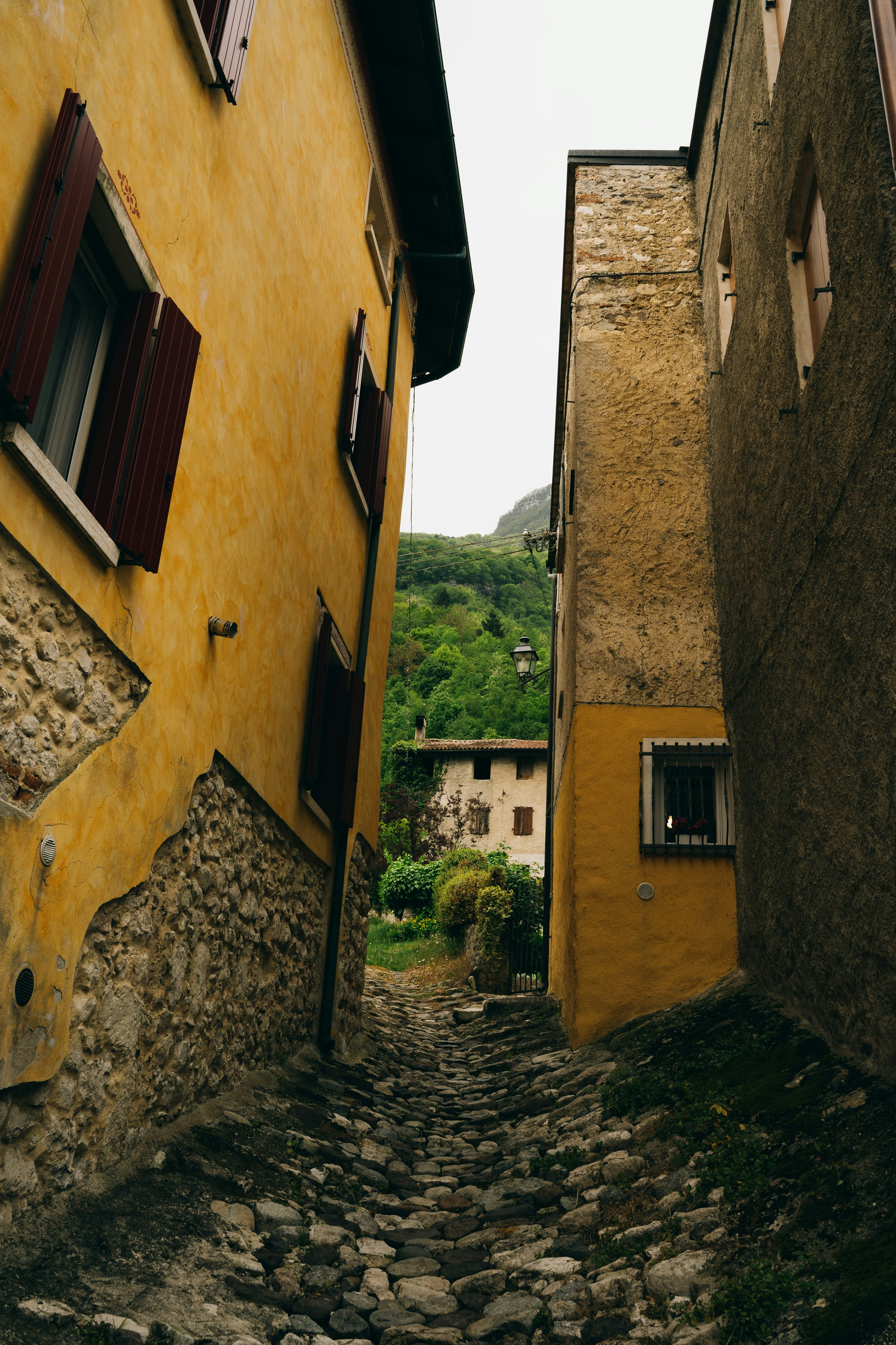 Between the Yellow Facades: A Cobblestone Alley to the Hidden Village